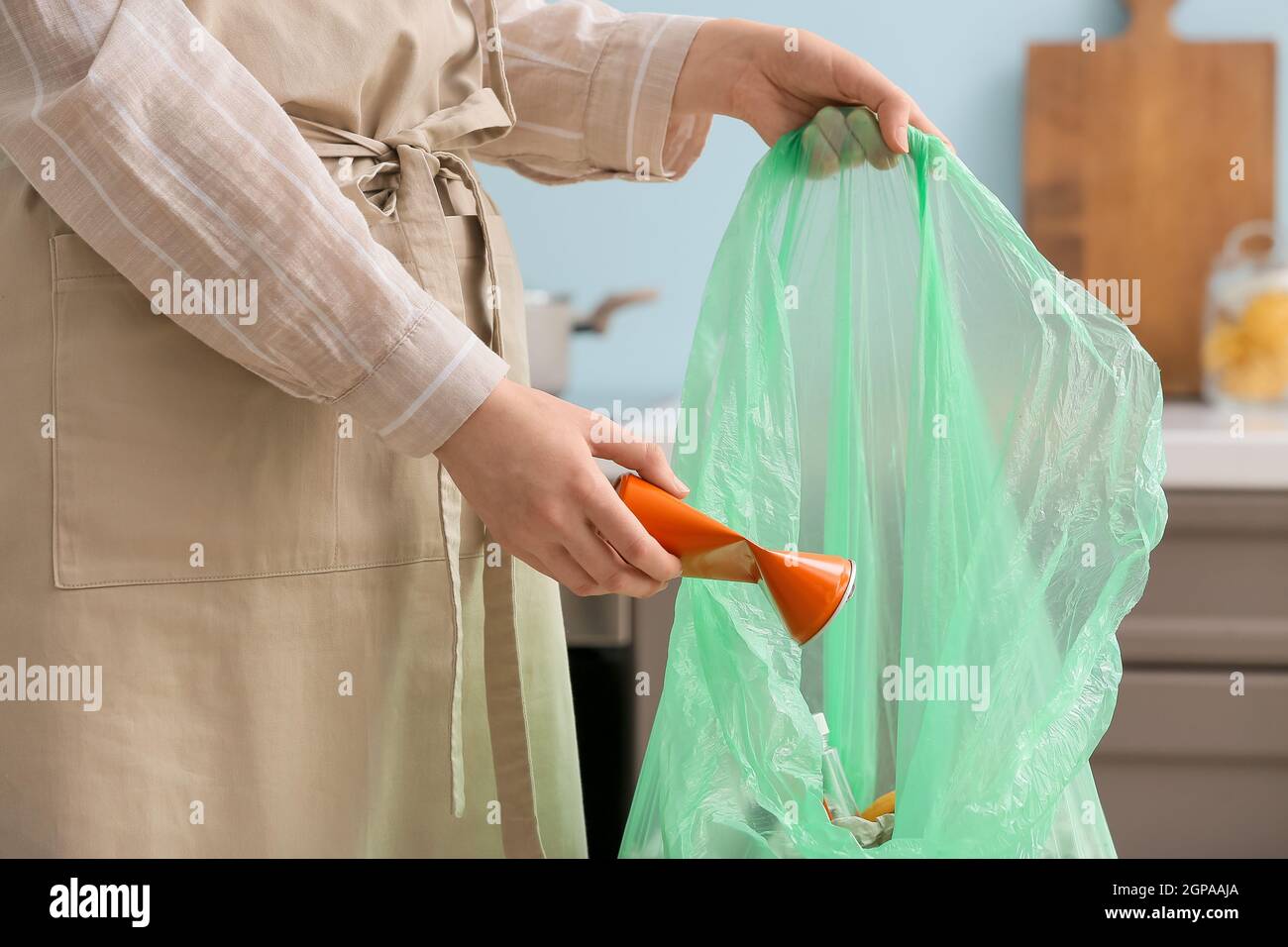 Female throwing plastic bag in hi-res stock photography and images - Alamy