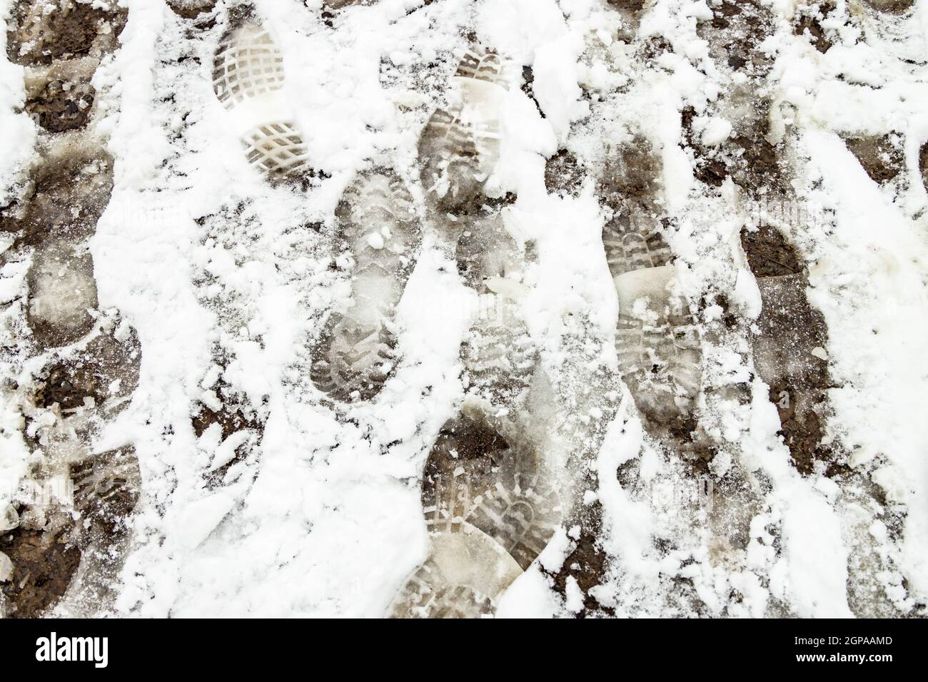 Foot imprint in snow on street display frozen pattern Stock Photo - Alamy