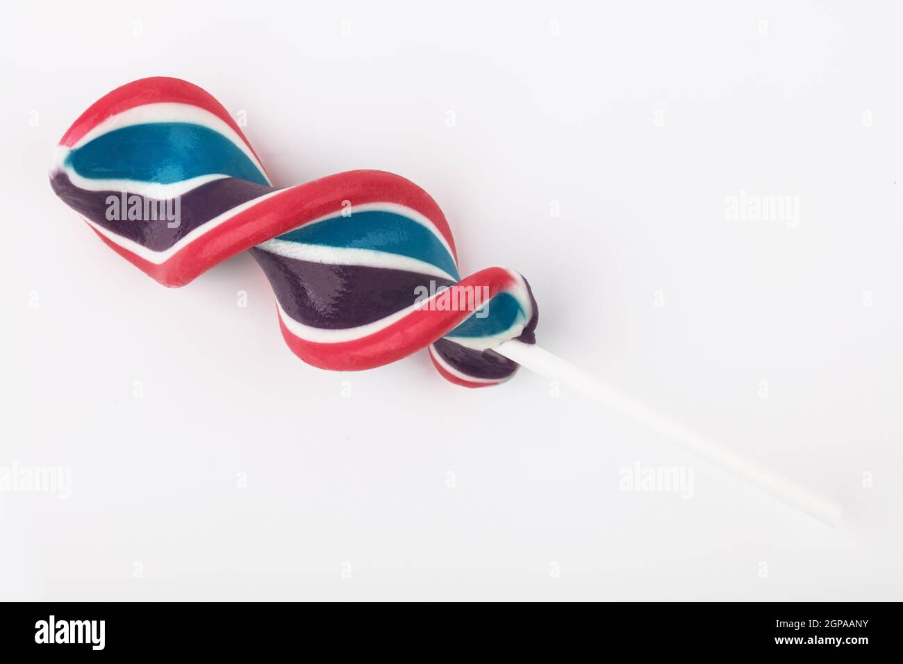 Lollipop with blue, purple and red stripes over white background Stock ...