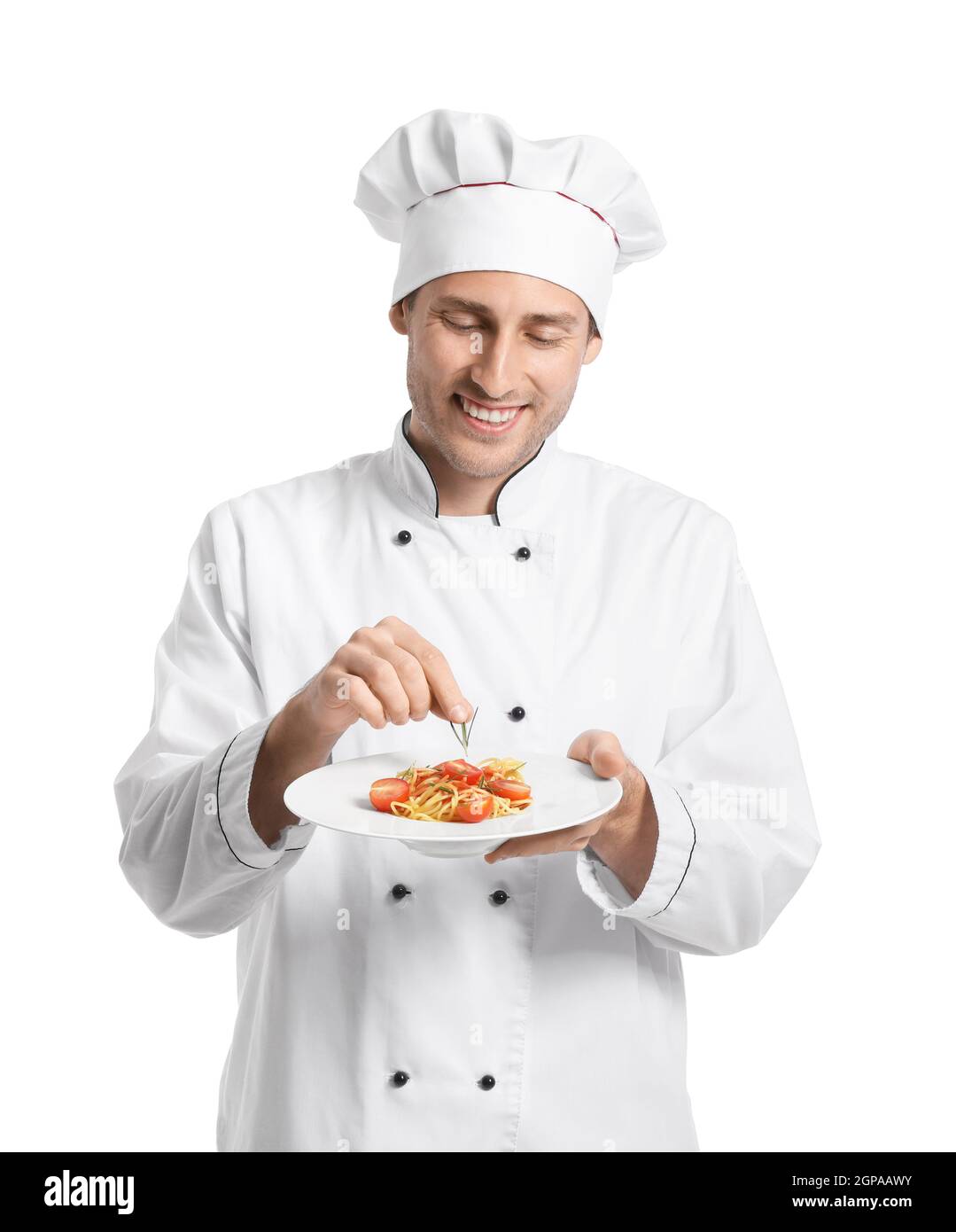 Handsome young chef putting hi-res stock photography and images - Alamy