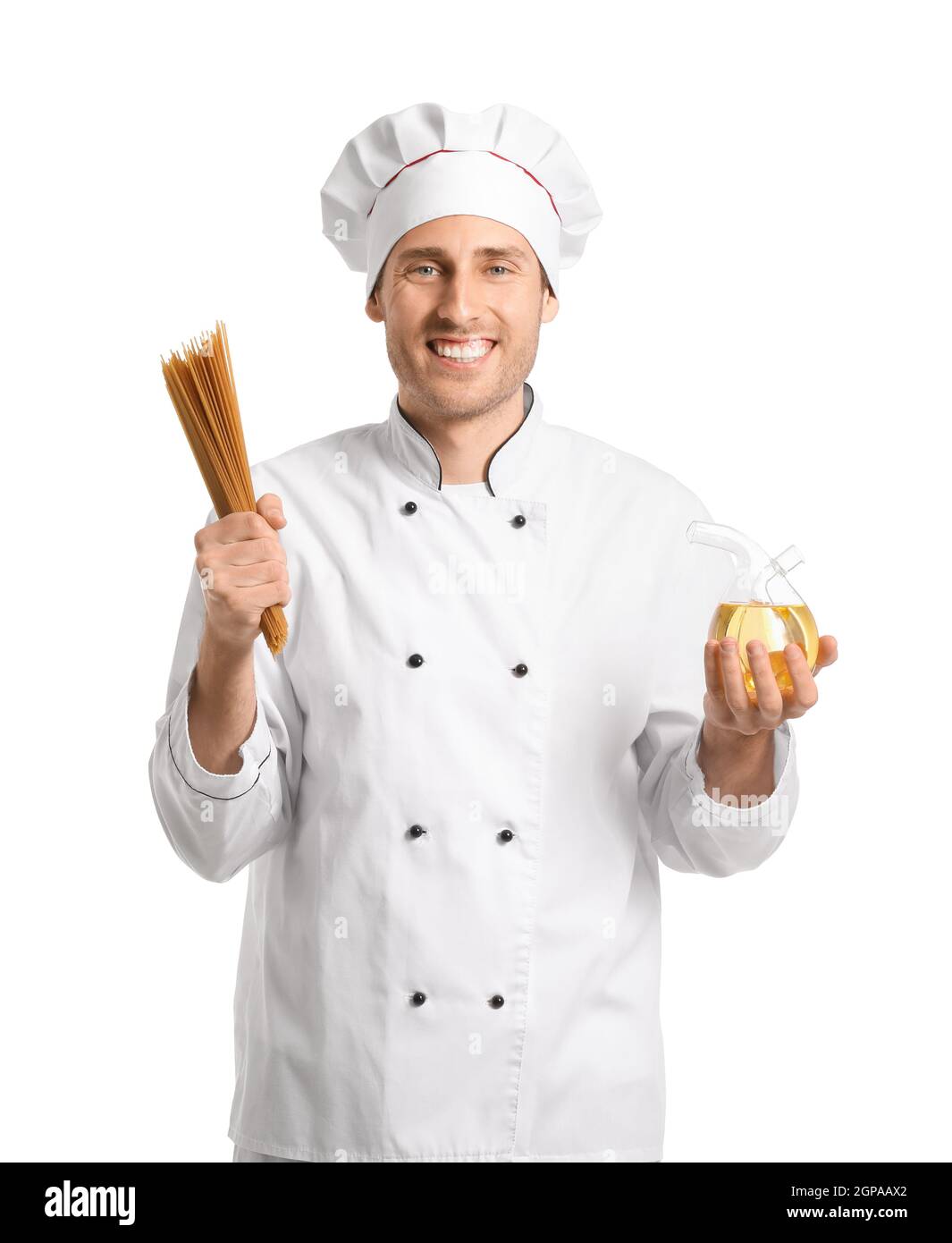 Handsome chef with raw spaghetti and oil on white background Stock ...