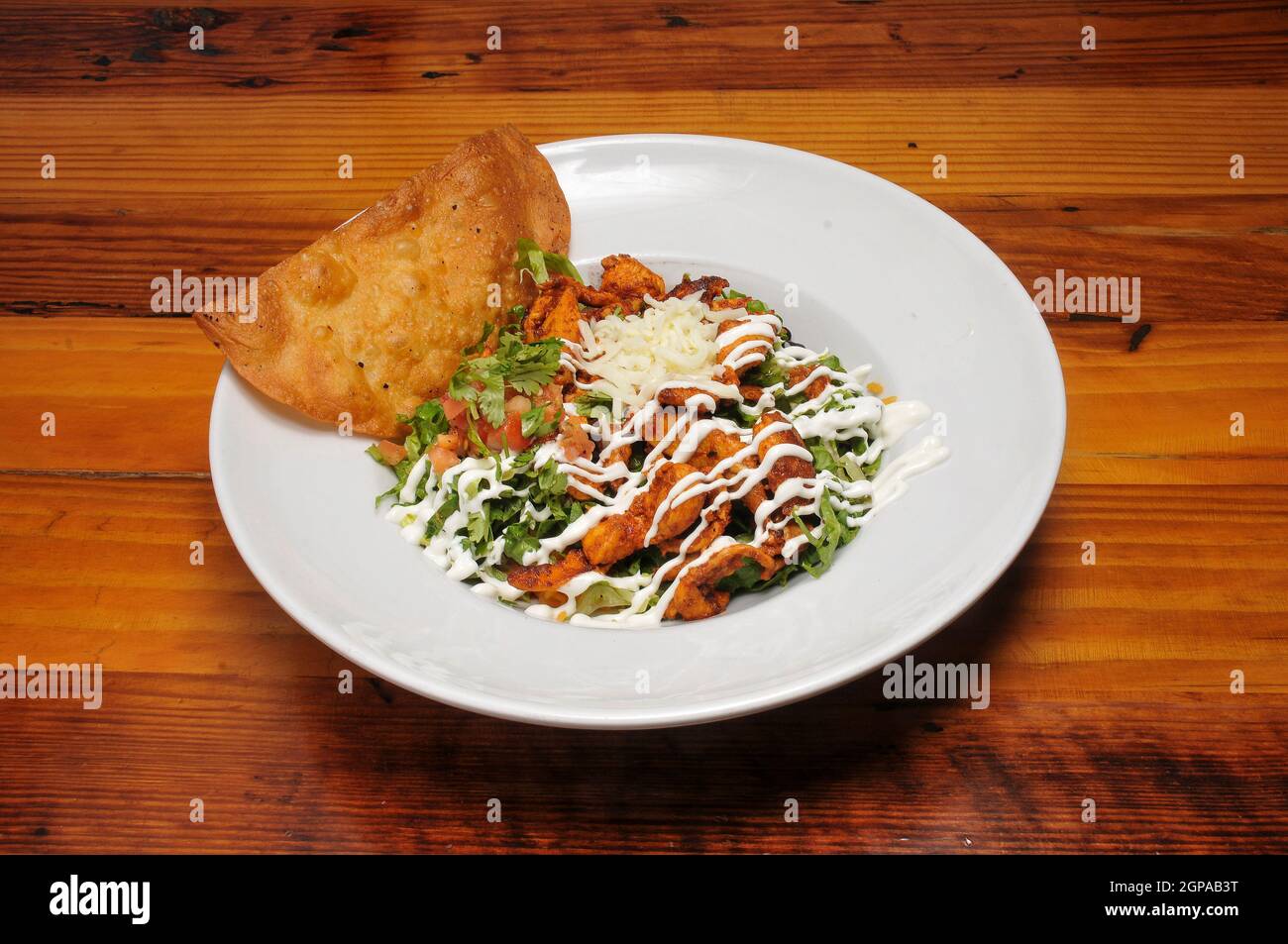 Traditional and authentic tex mex cuisine known as a chicken burrito ...