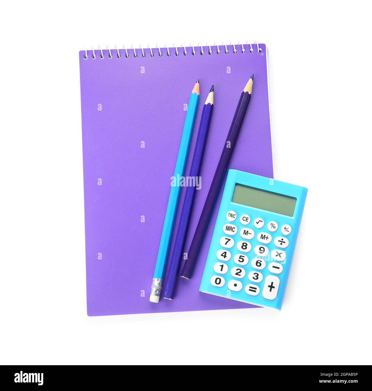 Notepad, calculator and different pencils on white background Stock ...