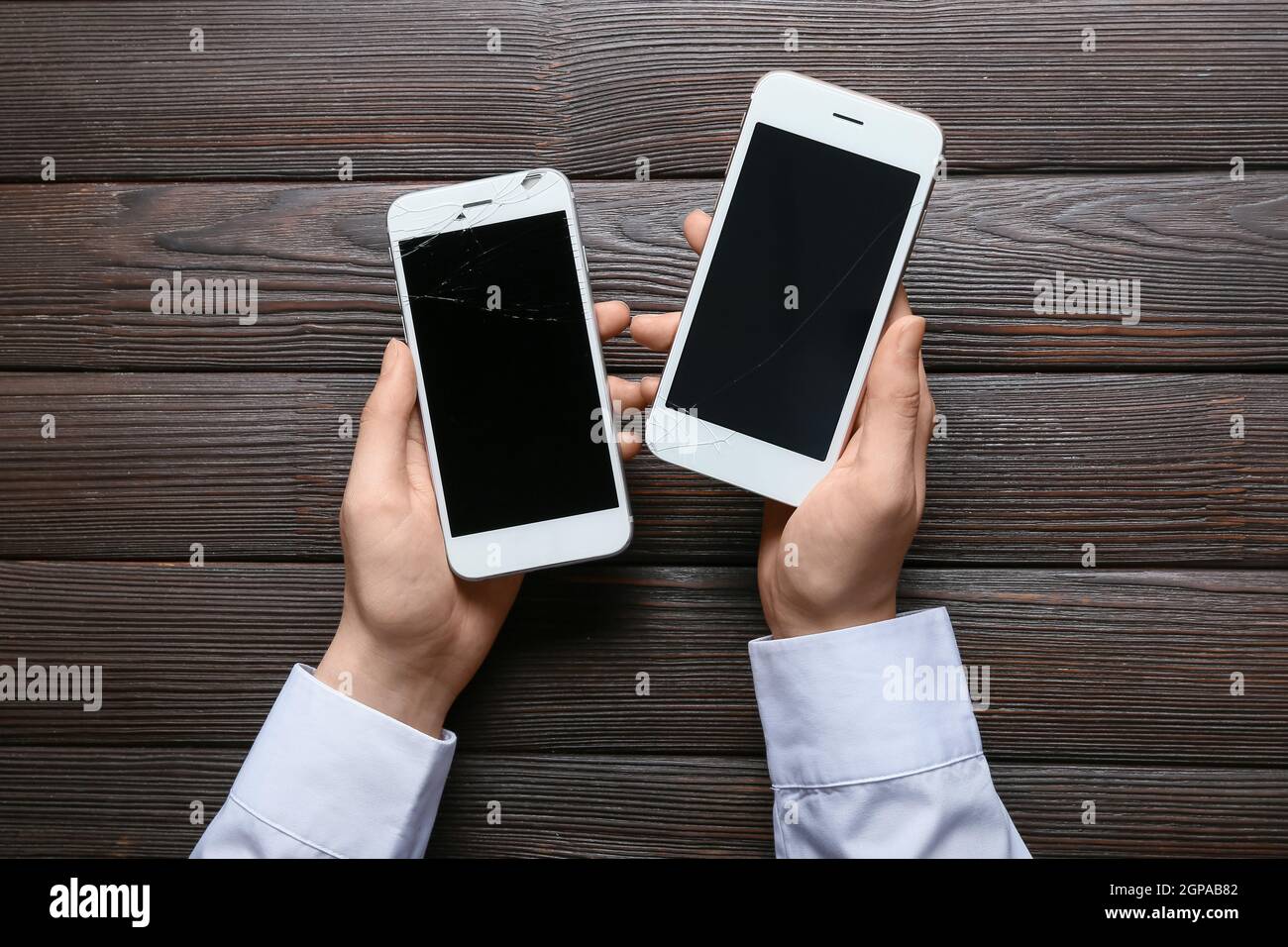 Woman holding broken smartphone hi-res stock photography and images - Alamy