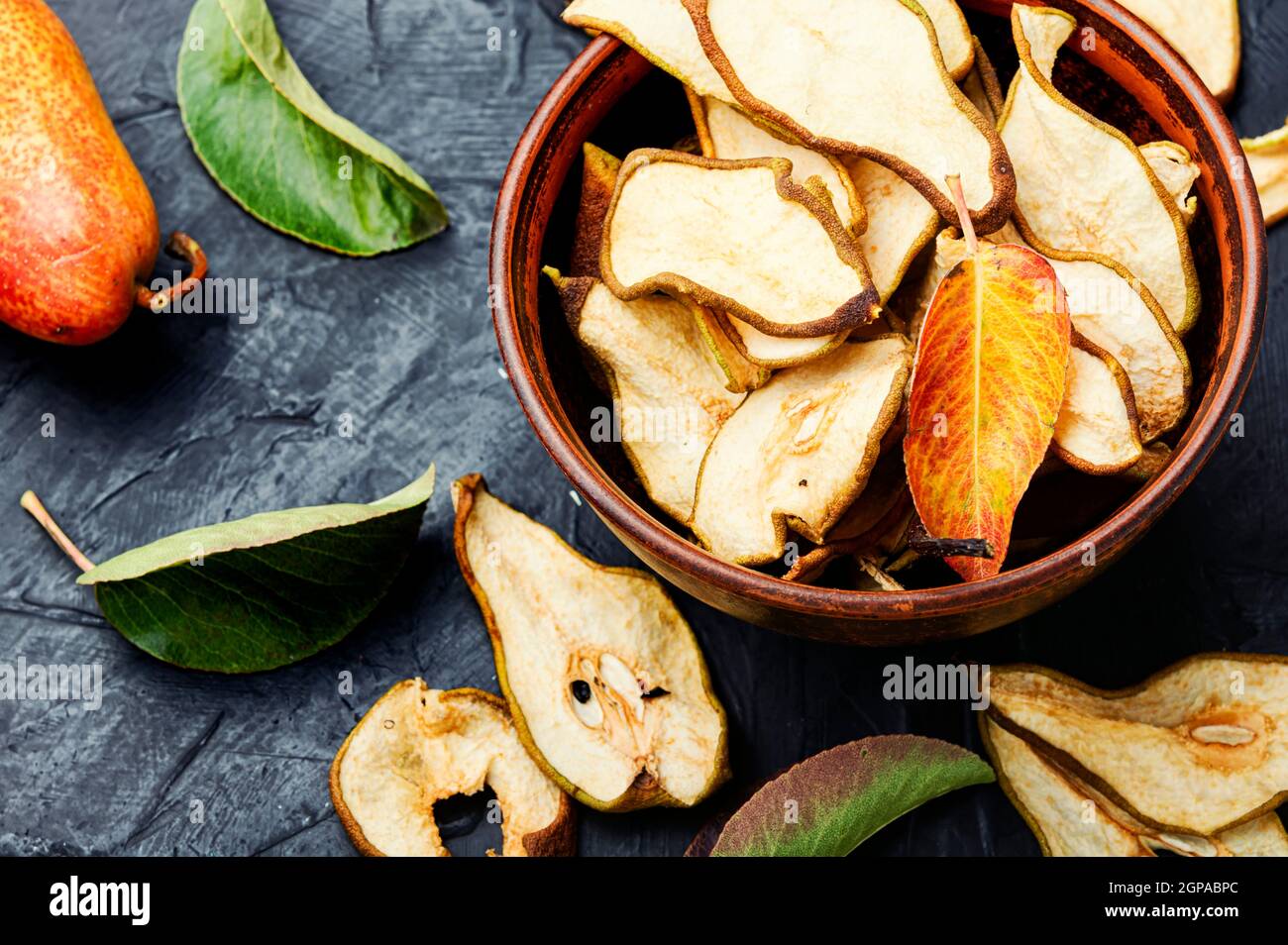 Sliced dried pear pieces.Dried pear or pear chips.Dried fruits Stock ...