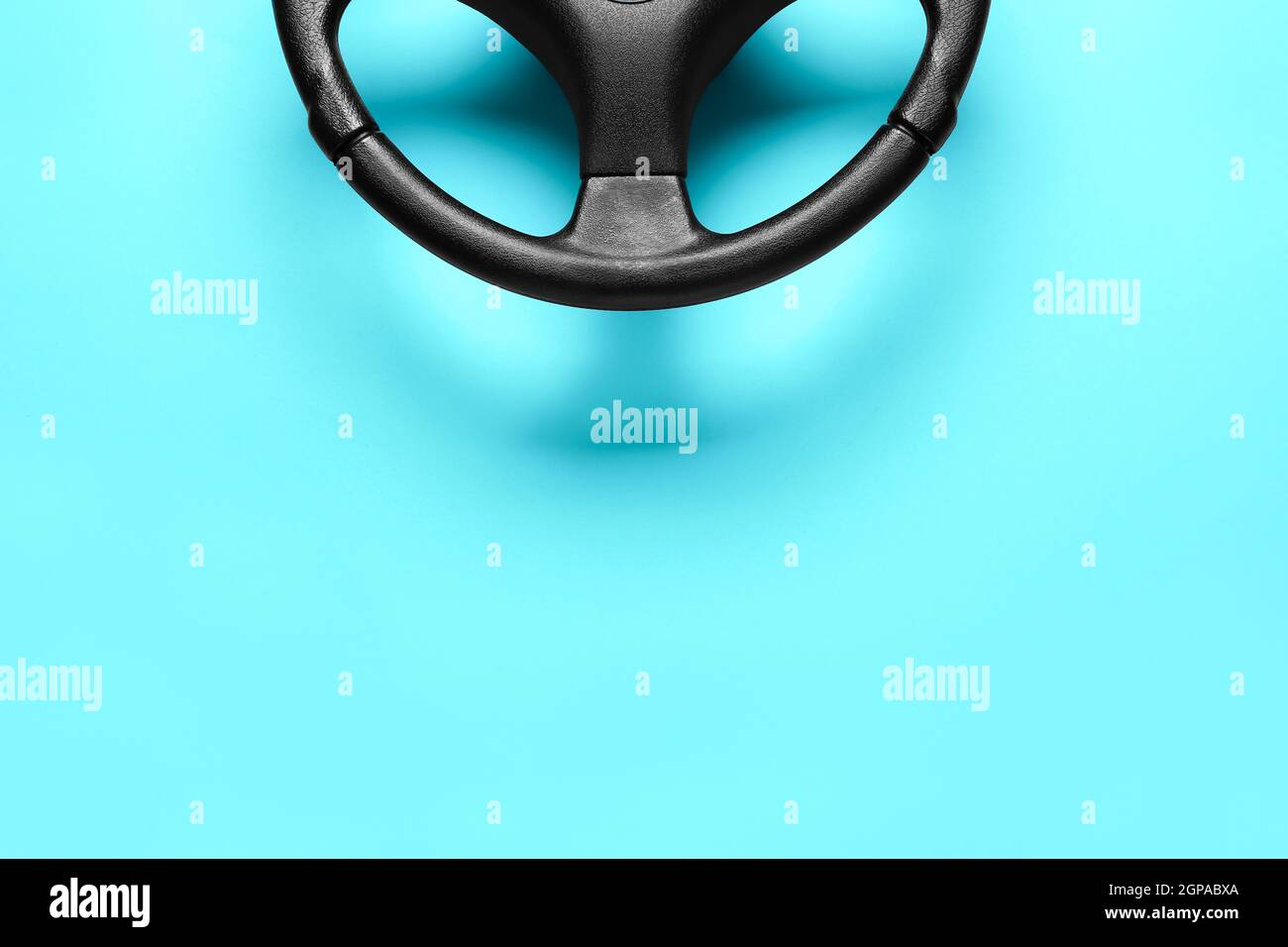 Modern steering wheel on color background, closeup Stock Photo - Alamy