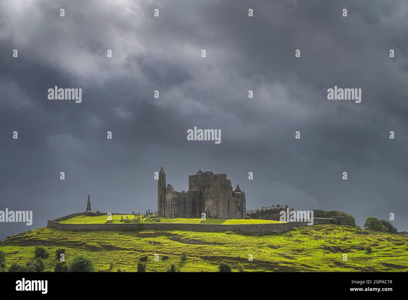 Rock of Cashel castle illuminated by sunlight and surrounded by ...