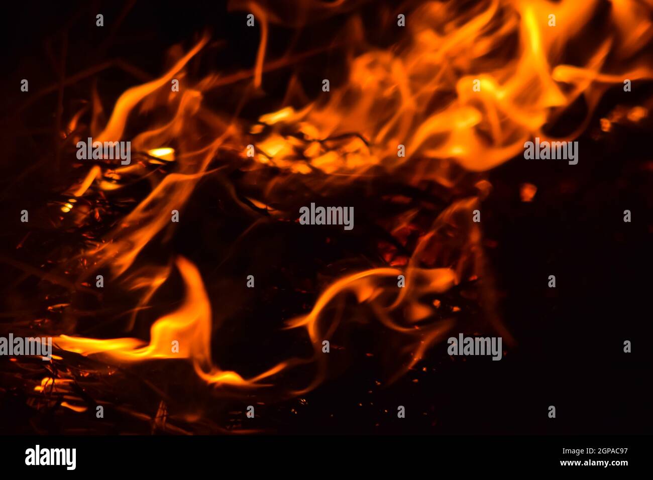 Fire fire. Burning of rice straw at night. Red fire on a black ...