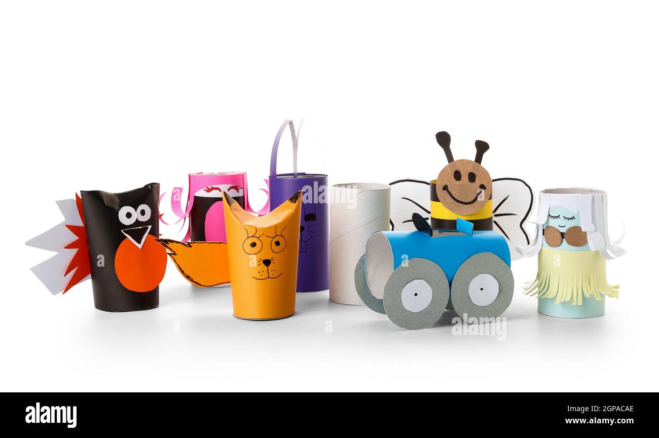 Different figures made of cardboard tube for toilet paper on white ...