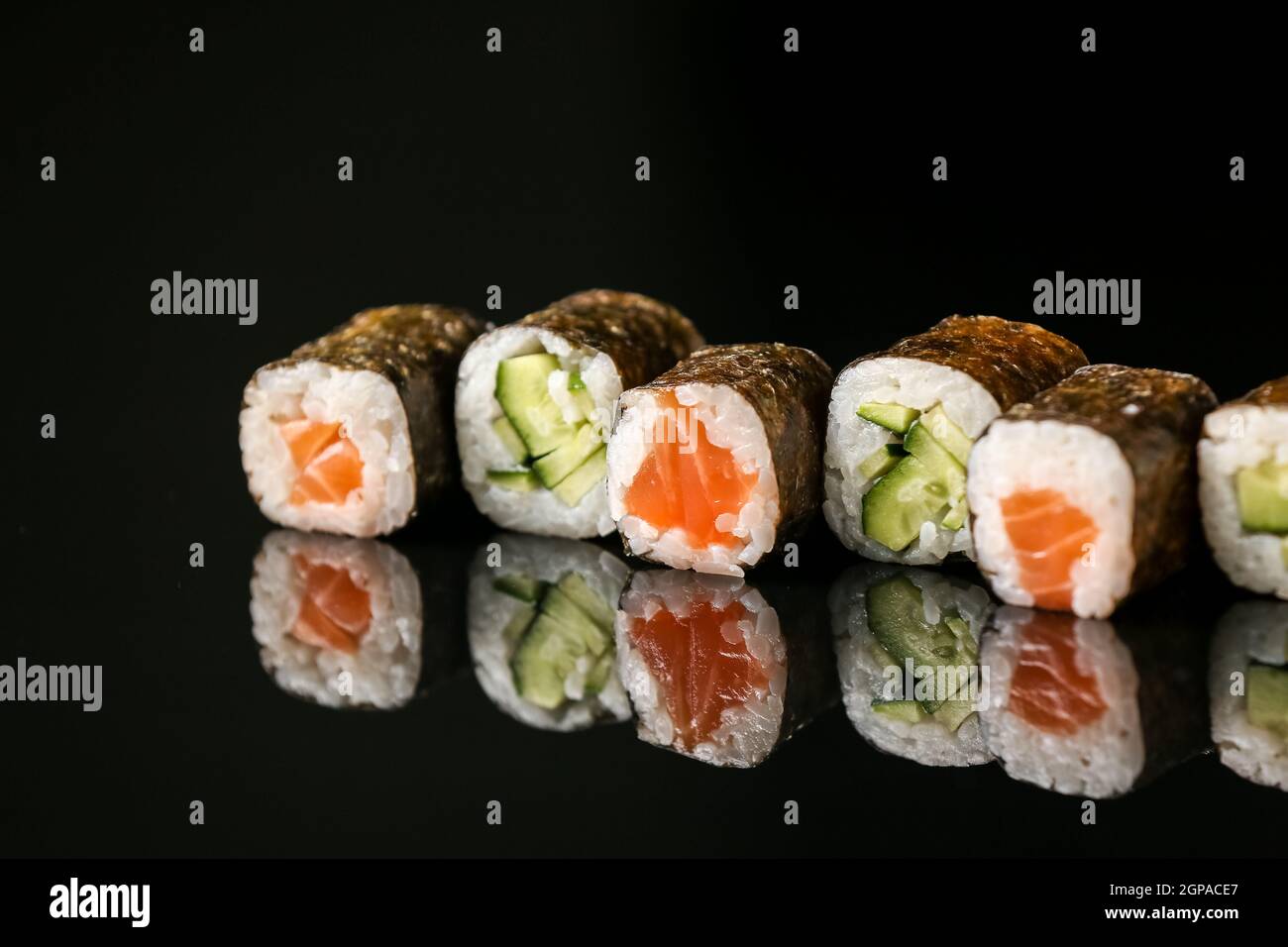 Set of different maki rolls on dark background, closeup Stock Photo - Alamy