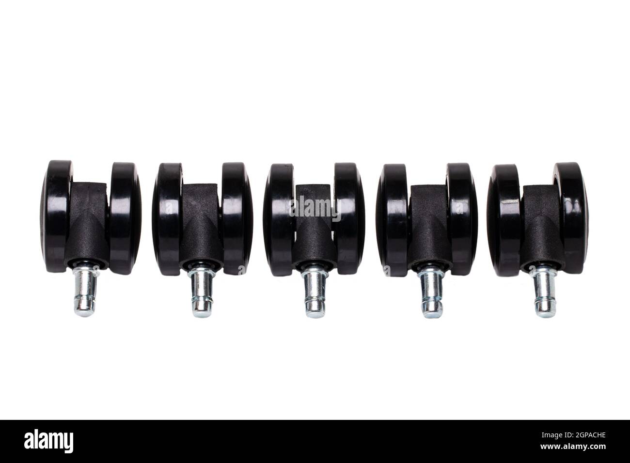 Spare parts isolated. Closeup of five black plastic wheels for a office ...