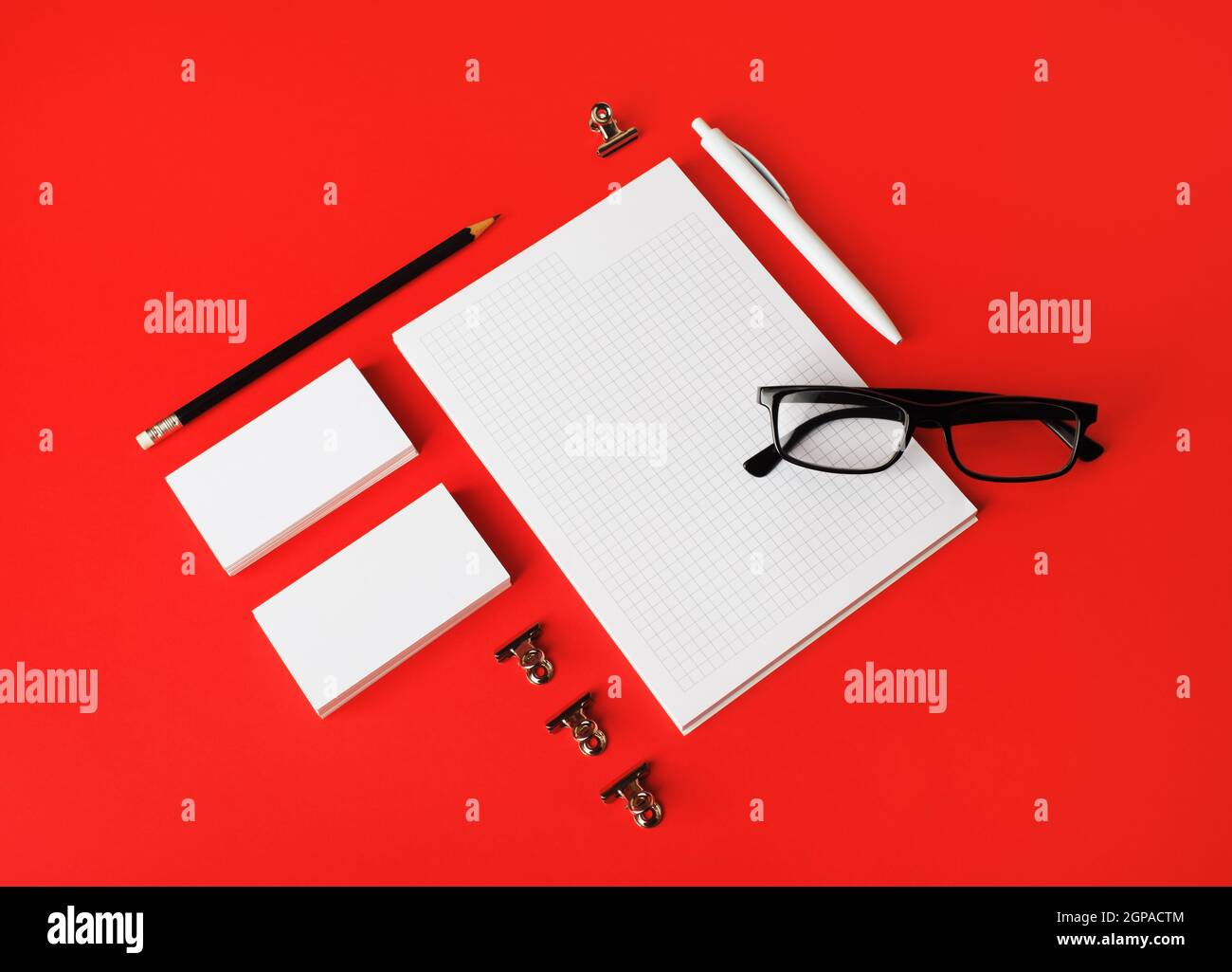 Blank stationery set on red paper background. Template for branding ...