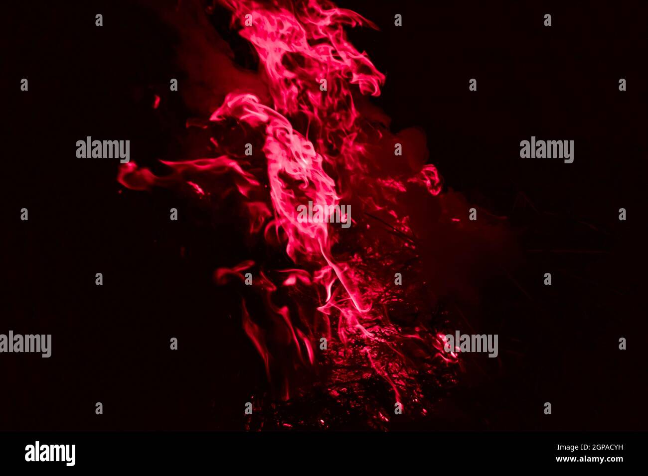 Fire. Burning of rice straw at night. A dark red flame Stock Photo - Alamy