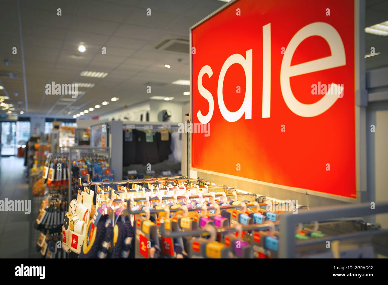 Sale sign text in clothing store marketplace, shopping in the mall ...
