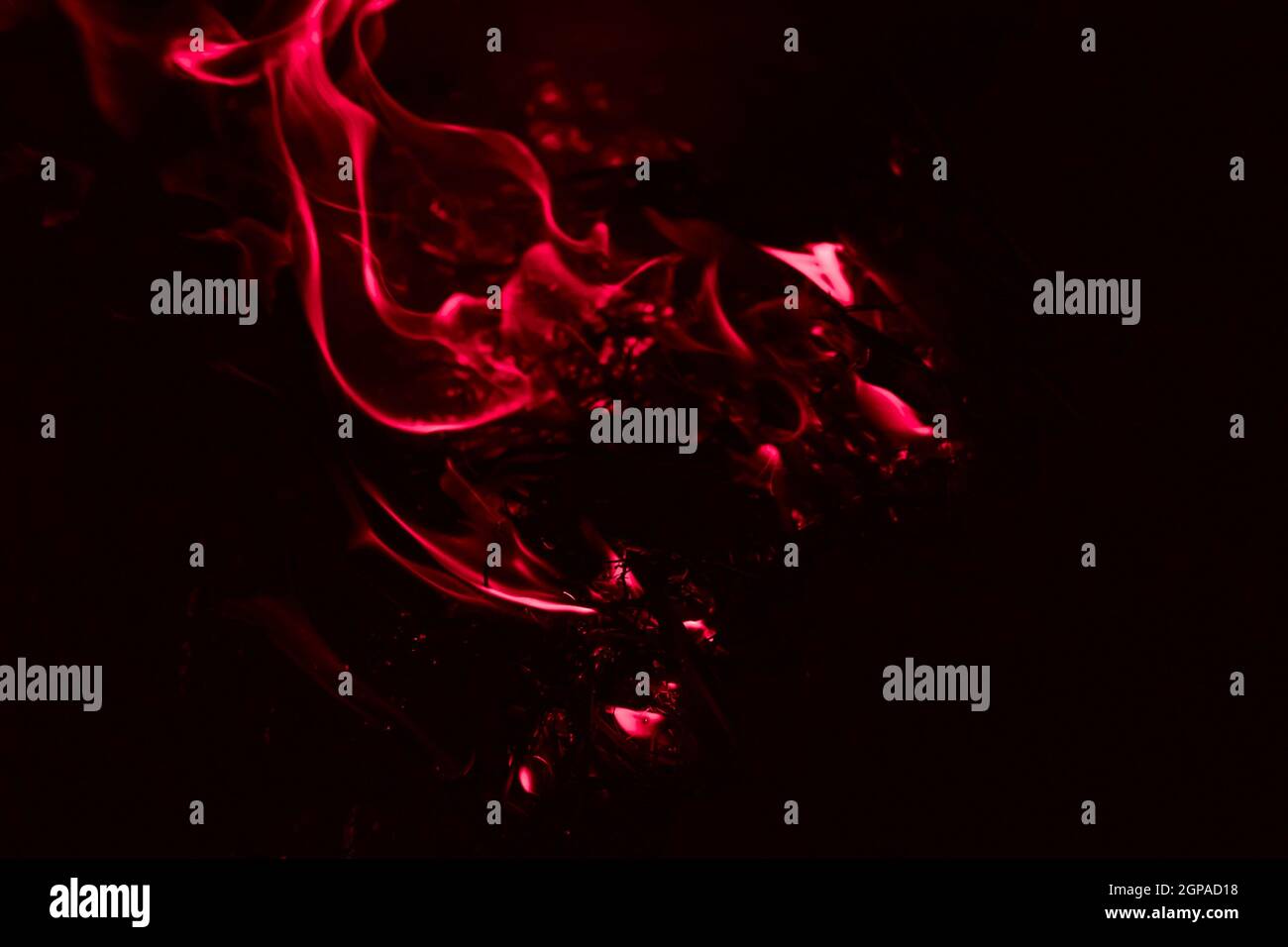 Fire. Burning of rice straw at night. A dark red flame Stock Photo - Alamy