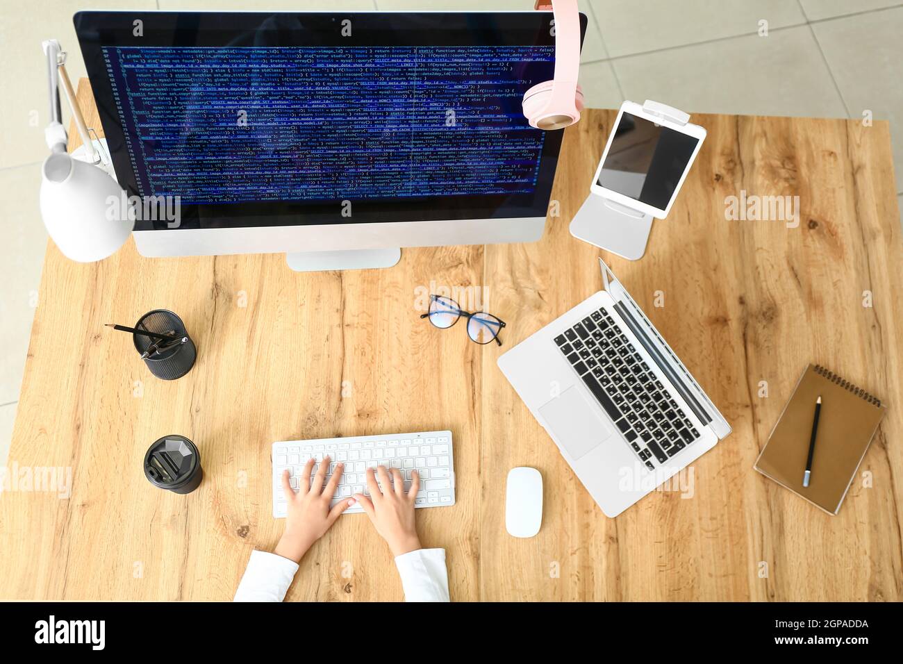 Little programmer using computer in office Stock Photo - Alamy