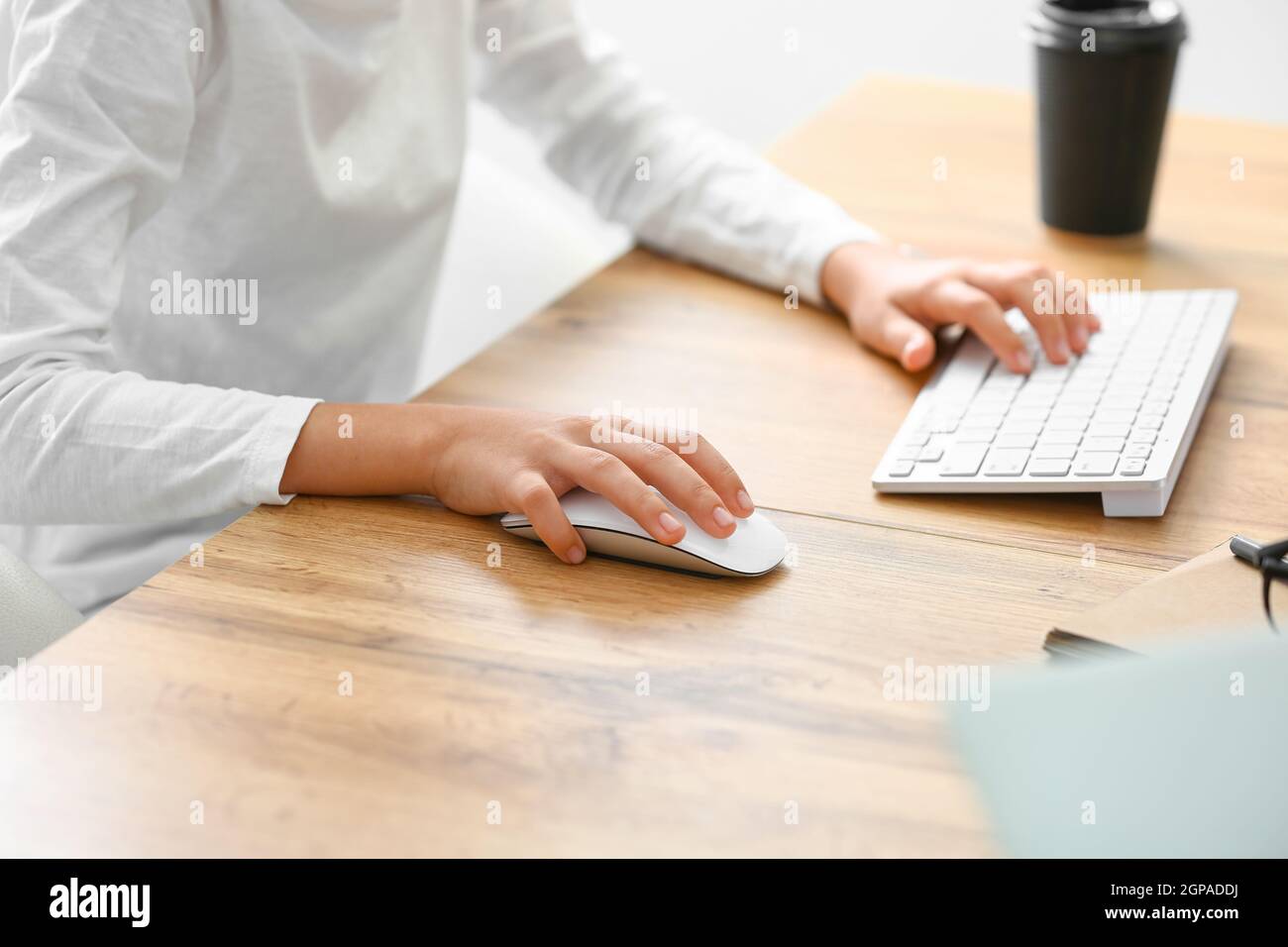 Little programmer using computer in office, closeup Stock Photo - Alamy