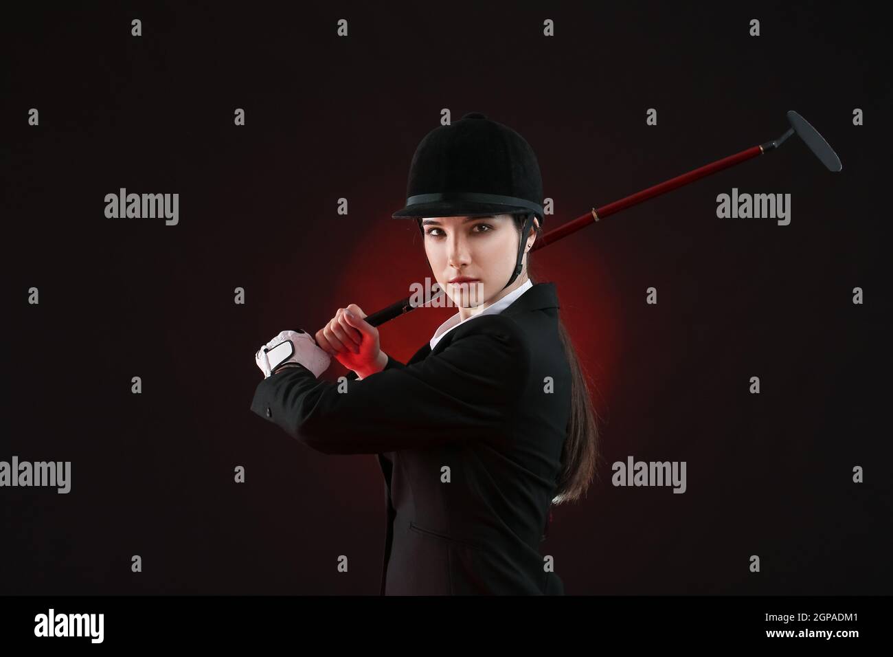 Beautiful female polo player on dark background Stock Photo - Alamy