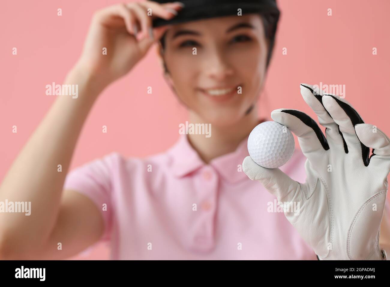 Beautiful female polo player with ball on color background Stock Photo ...