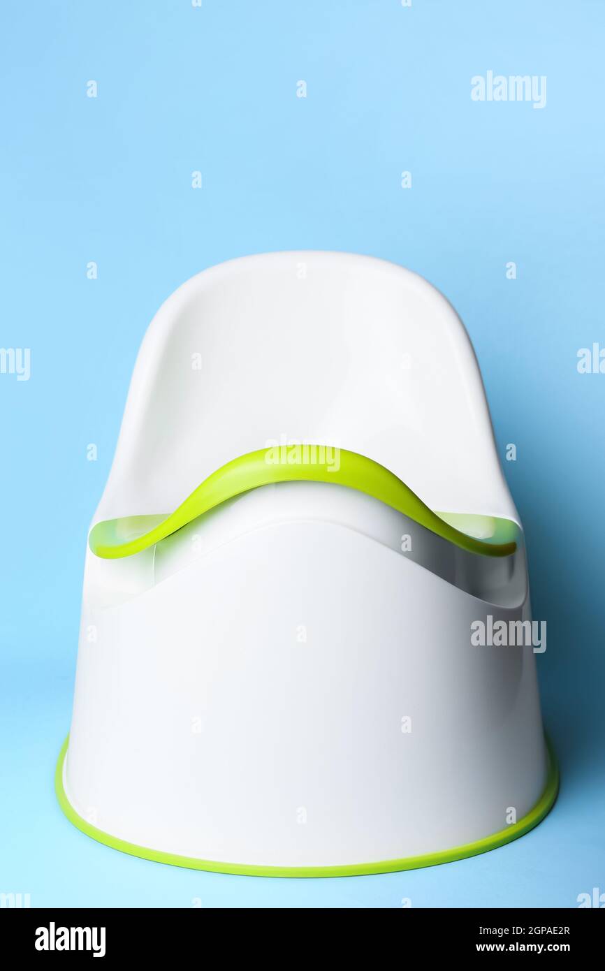 Potty on color background. Toilet training concept Stock Photo - Alamy