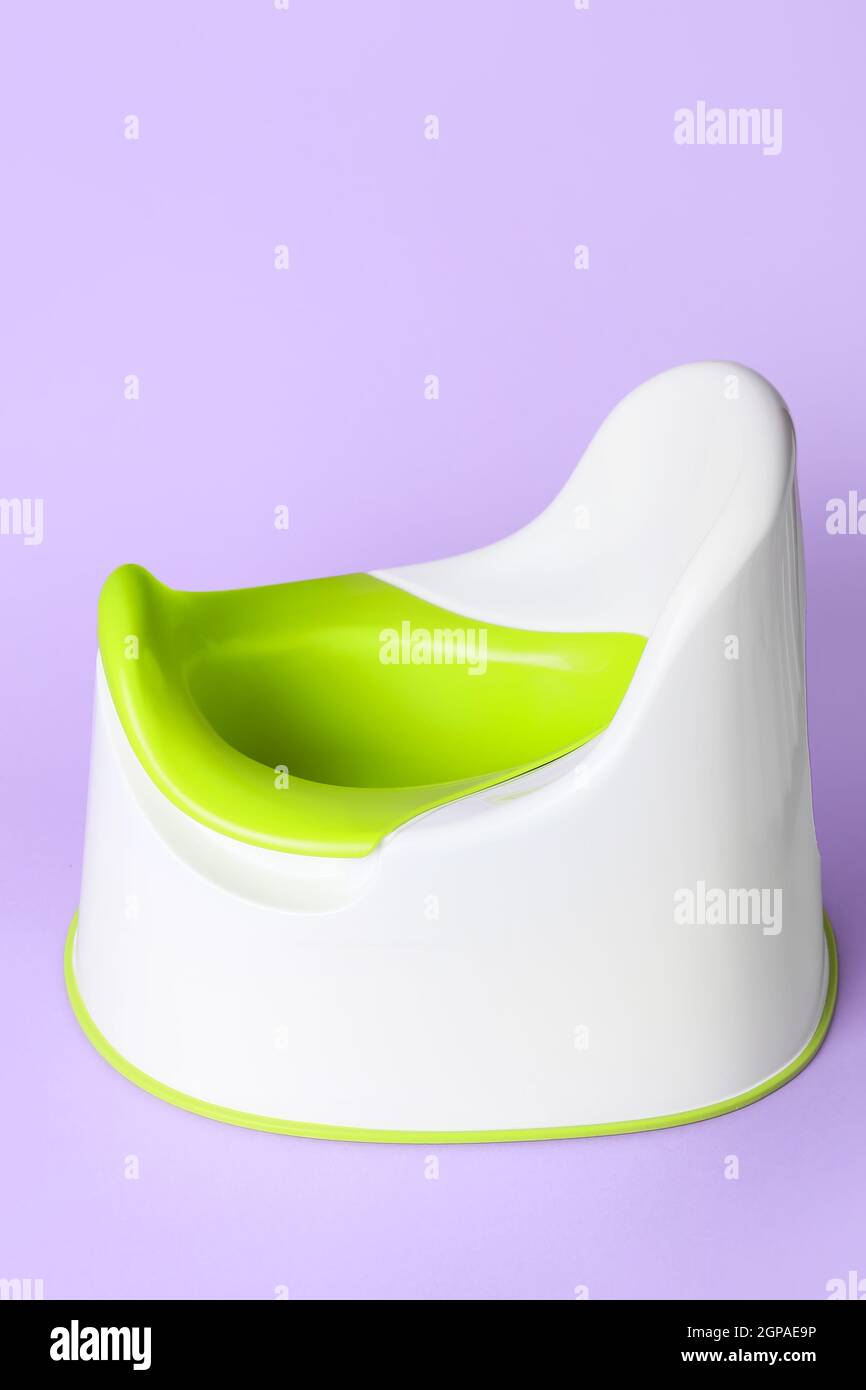Potty on color background. Toilet training concept Stock Photo - Alamy