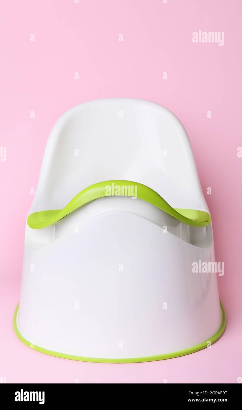 Potty on color background. Toilet training concept Stock Photo - Alamy