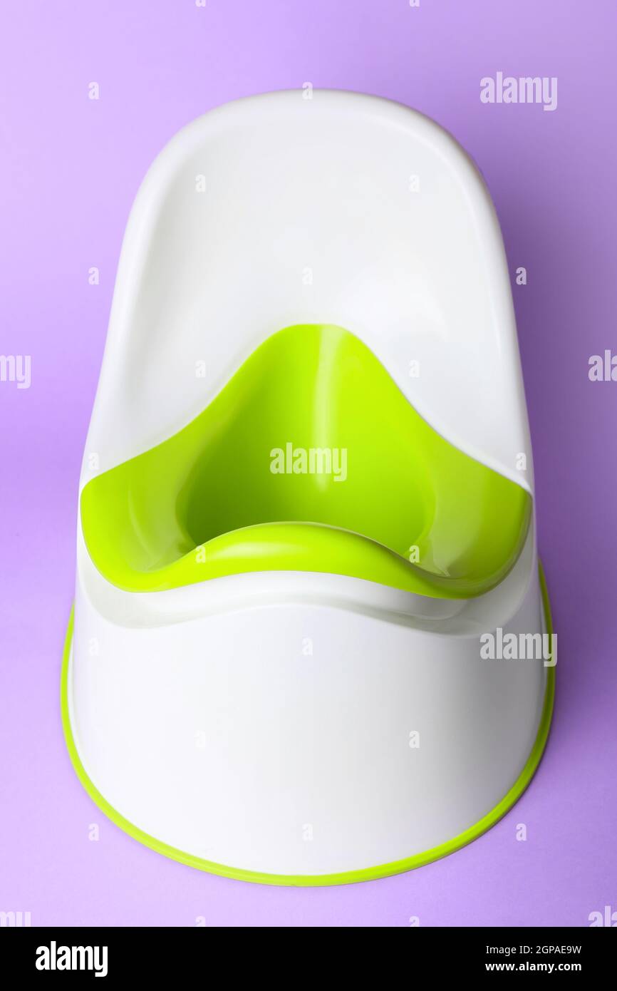 Potty on color background. Toilet training concept Stock Photo - Alamy