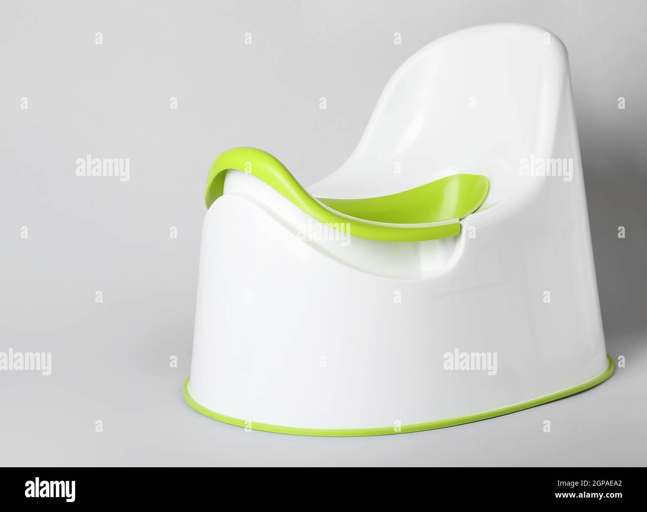 Potty on light background. Toilet training concept Stock Photo - Alamy