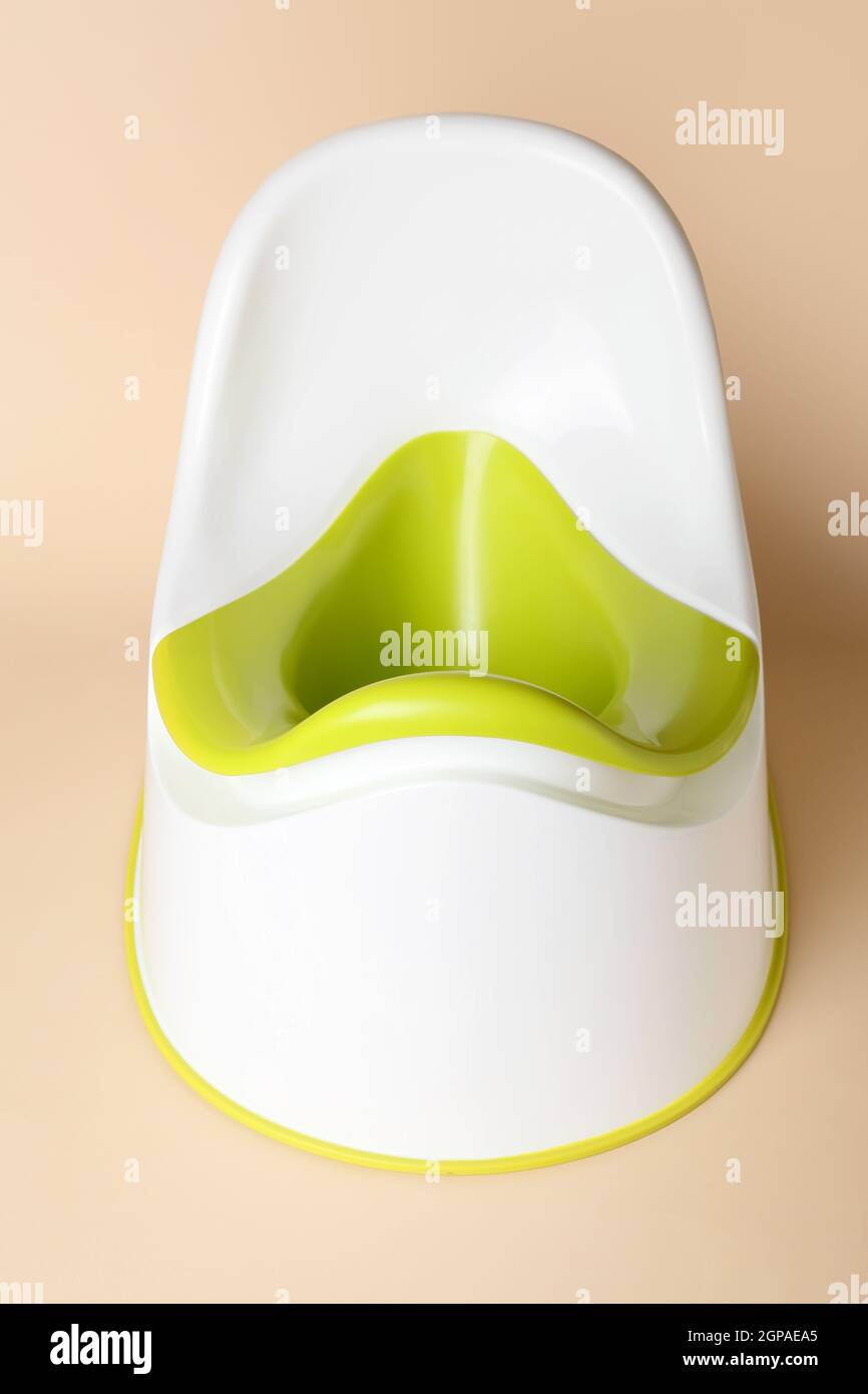 Potty on color background. Toilet training concept Stock Photo - Alamy