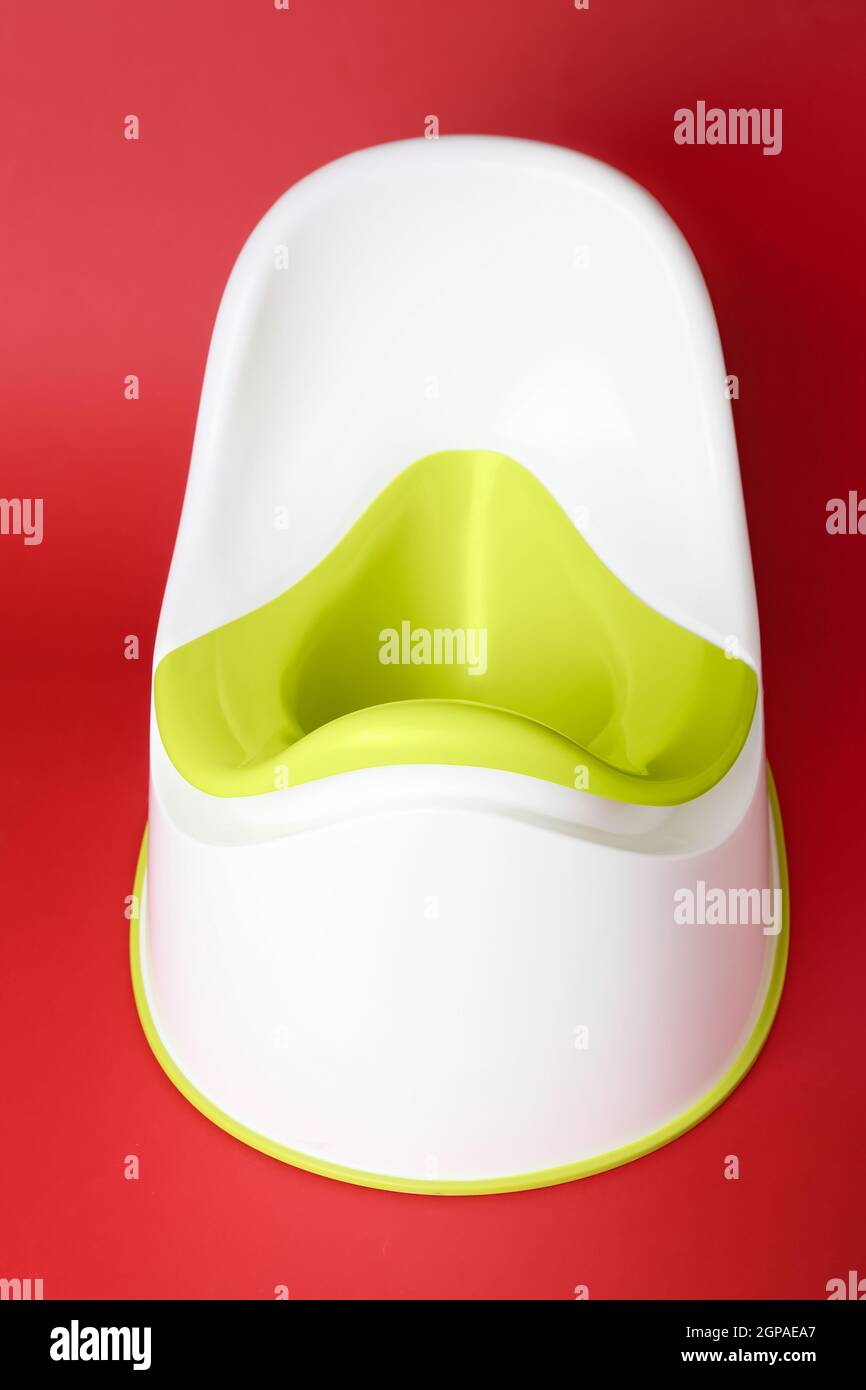 Potty on color background. Toilet training concept Stock Photo - Alamy