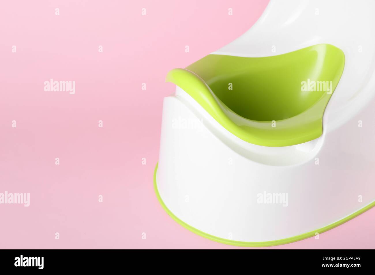 Potty on color background. Toilet training concept Stock Photo - Alamy