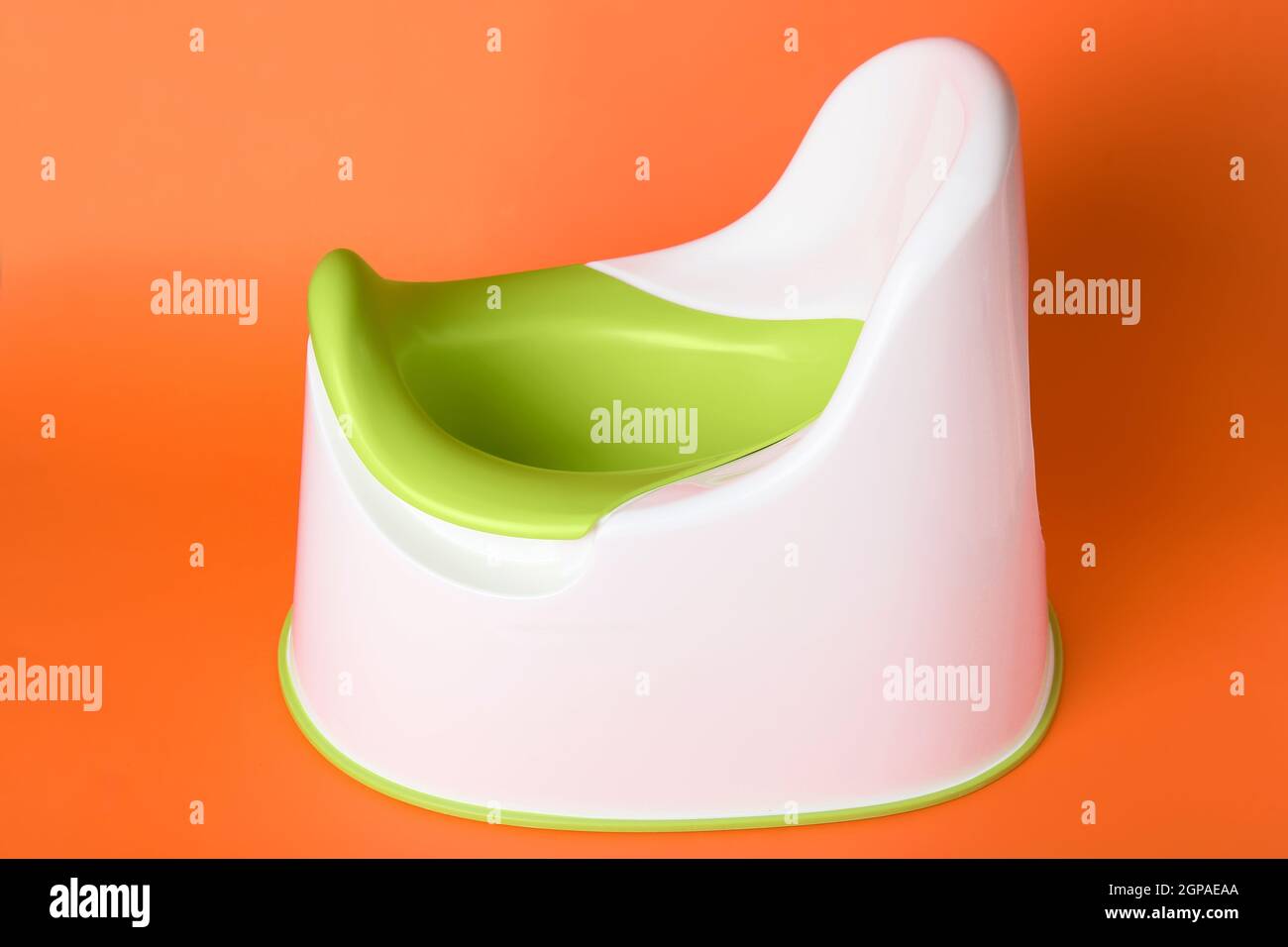 Potty on color background. Toilet training concept Stock Photo - Alamy