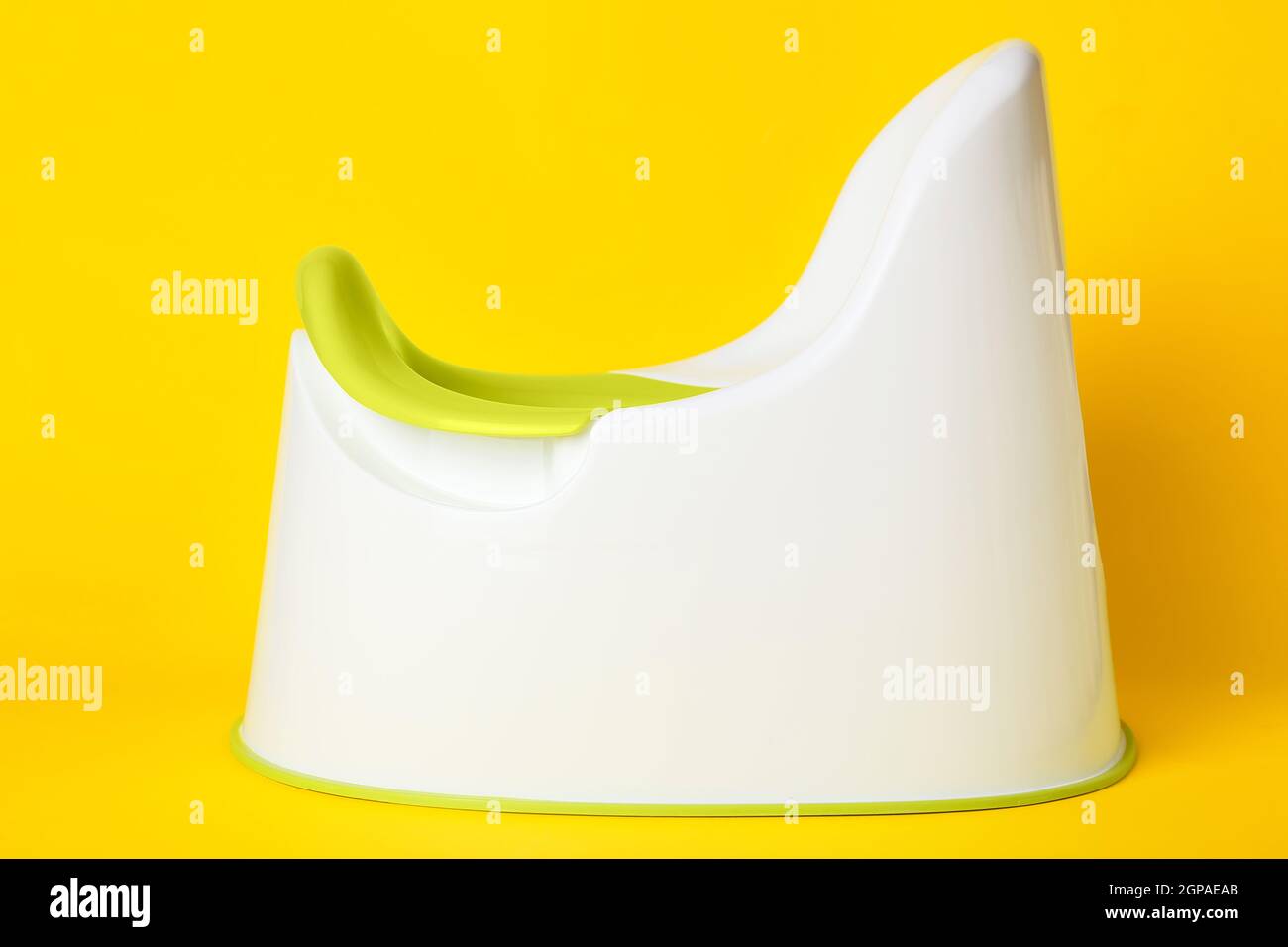 Potty on color background. Toilet training concept Stock Photo - Alamy
