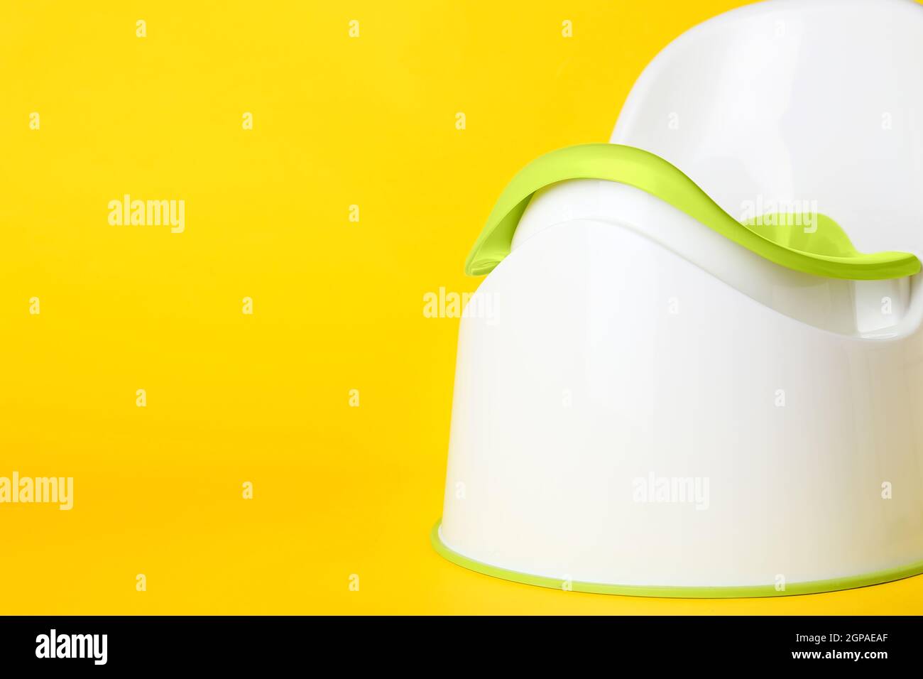Potty on color background. Toilet training concept Stock Photo - Alamy