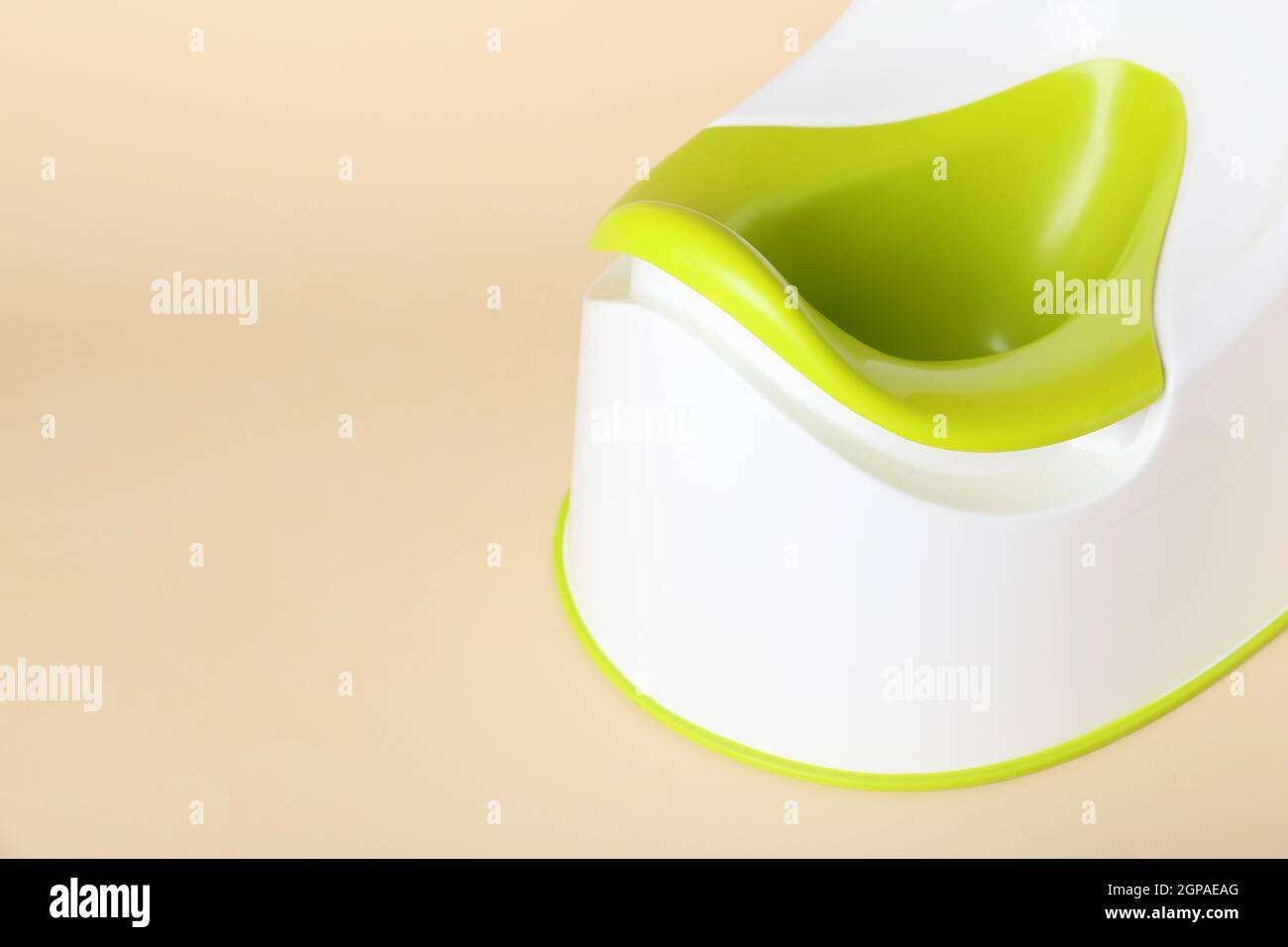 Potty on color background. Toilet training concept Stock Photo - Alamy
