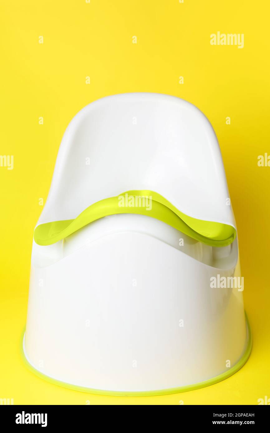 Potty on color background. Toilet training concept Stock Photo - Alamy