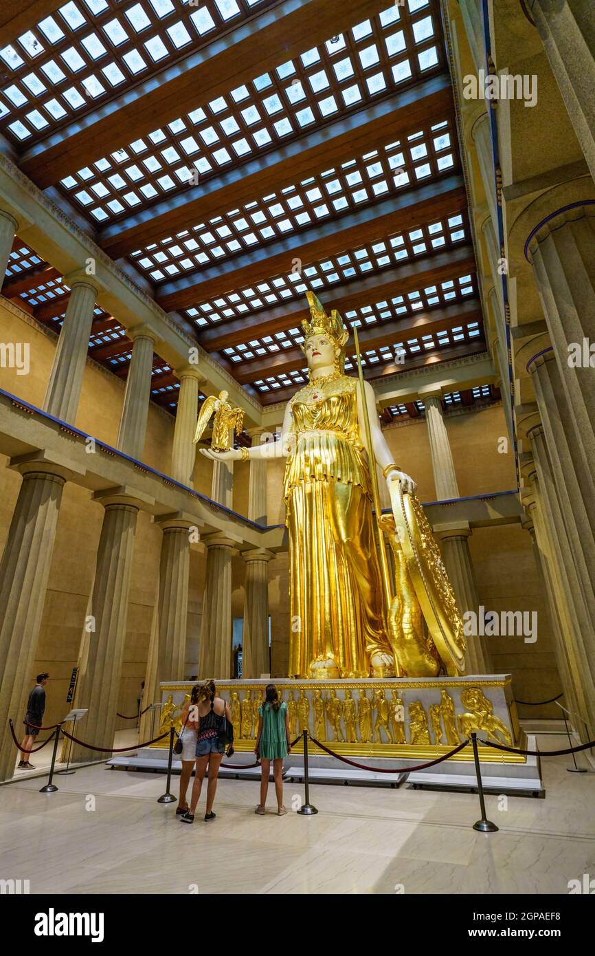 Visitors dwarfed by the 42 foot statue of the Goddess Athena inside the Parthenon in Nashville’s ...