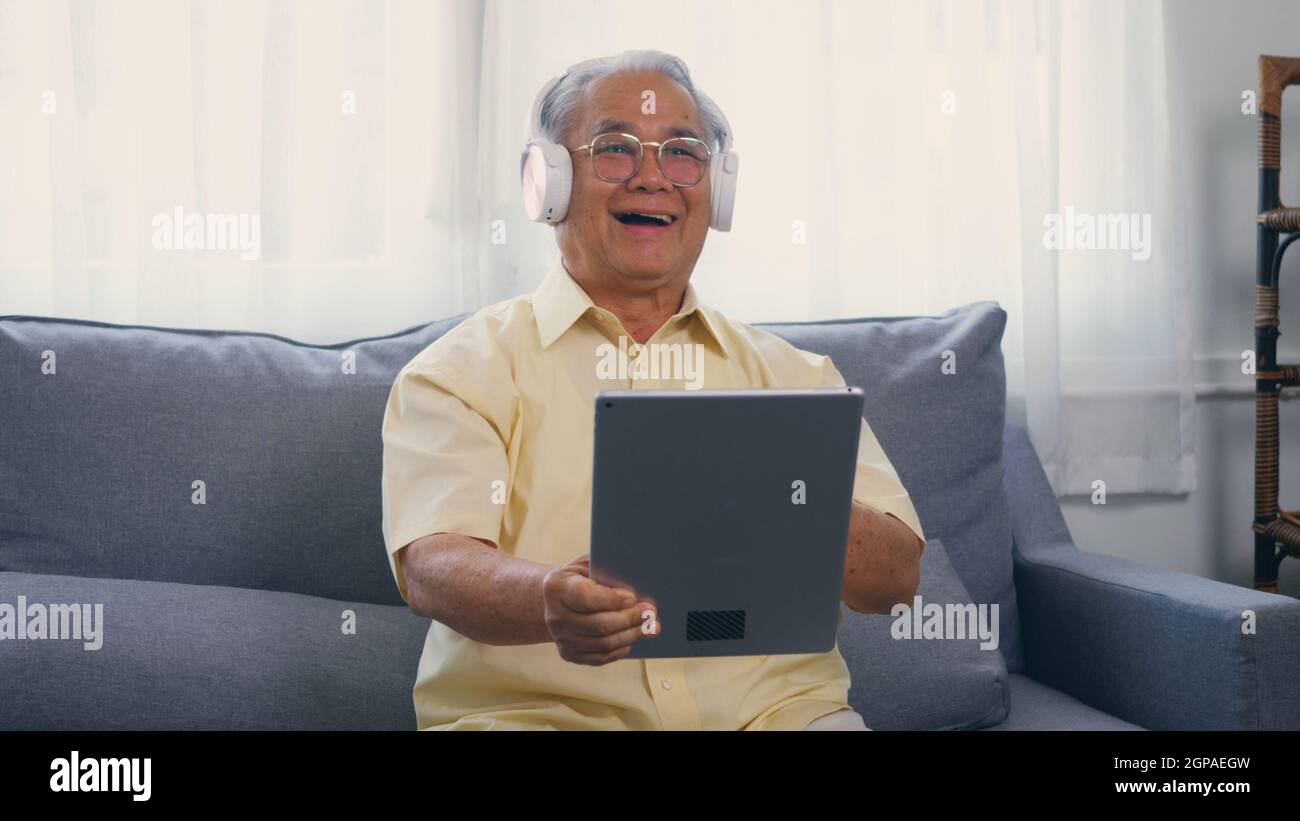Old man grandfather smile with eyeglasses relaxing wear headphones is ...