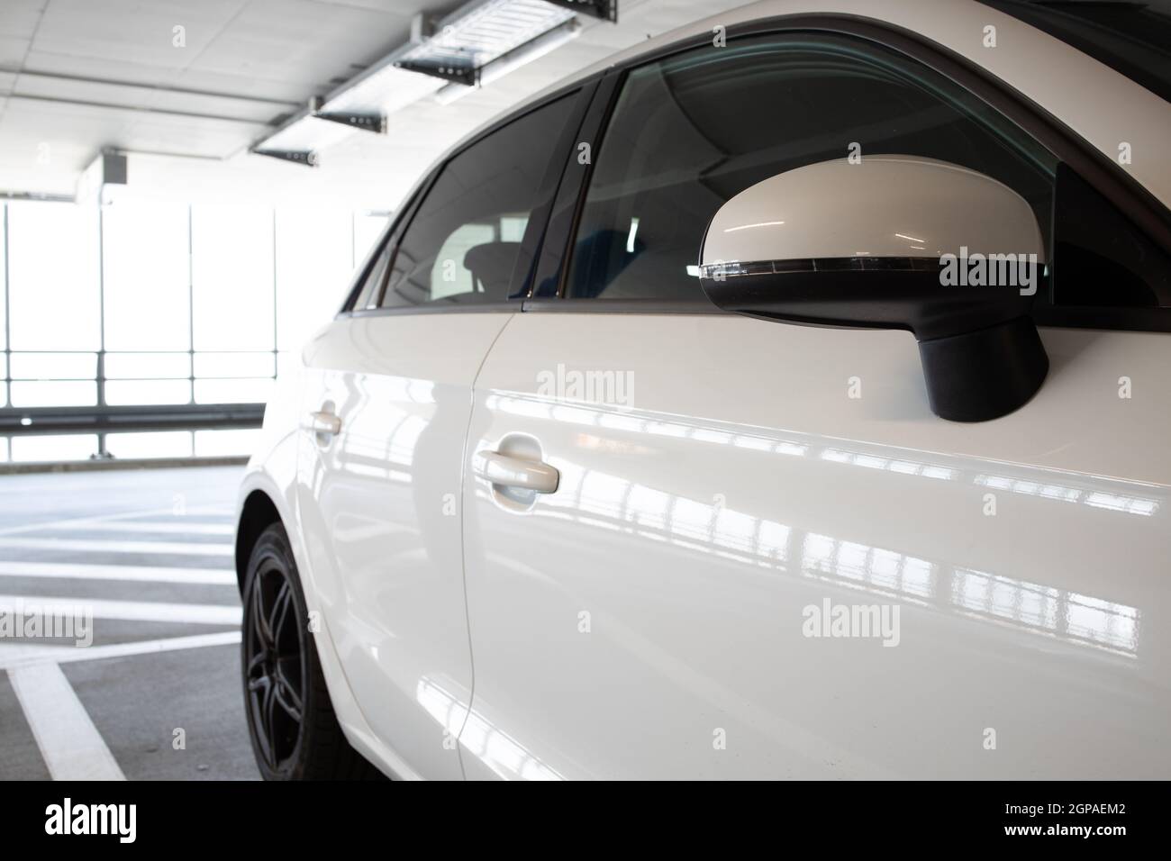 Underground parking. Cars parked in a garage with no people. Many cars ...