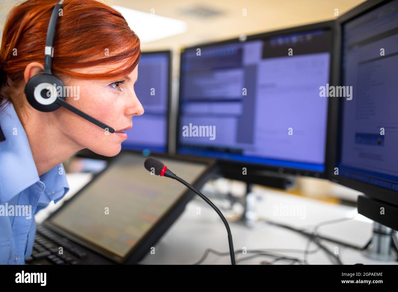 Call centre employee communicating over phone using an external ...