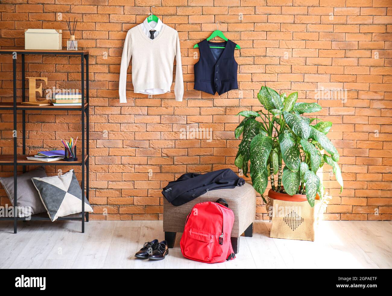 Dressing child school uniform hi-res stock photography and images - Alamy