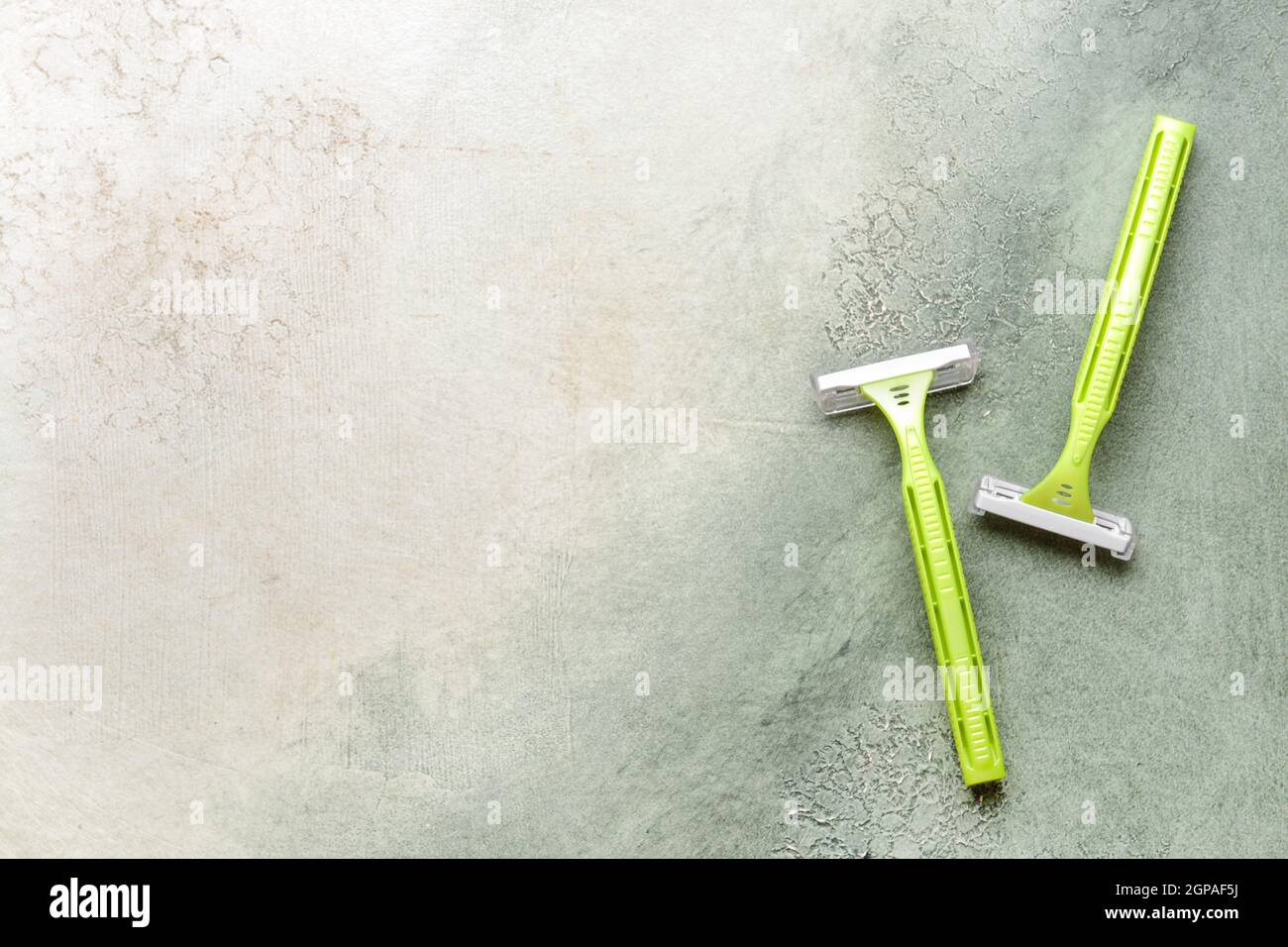 Safety razors on grunge background Stock Photo - Alamy