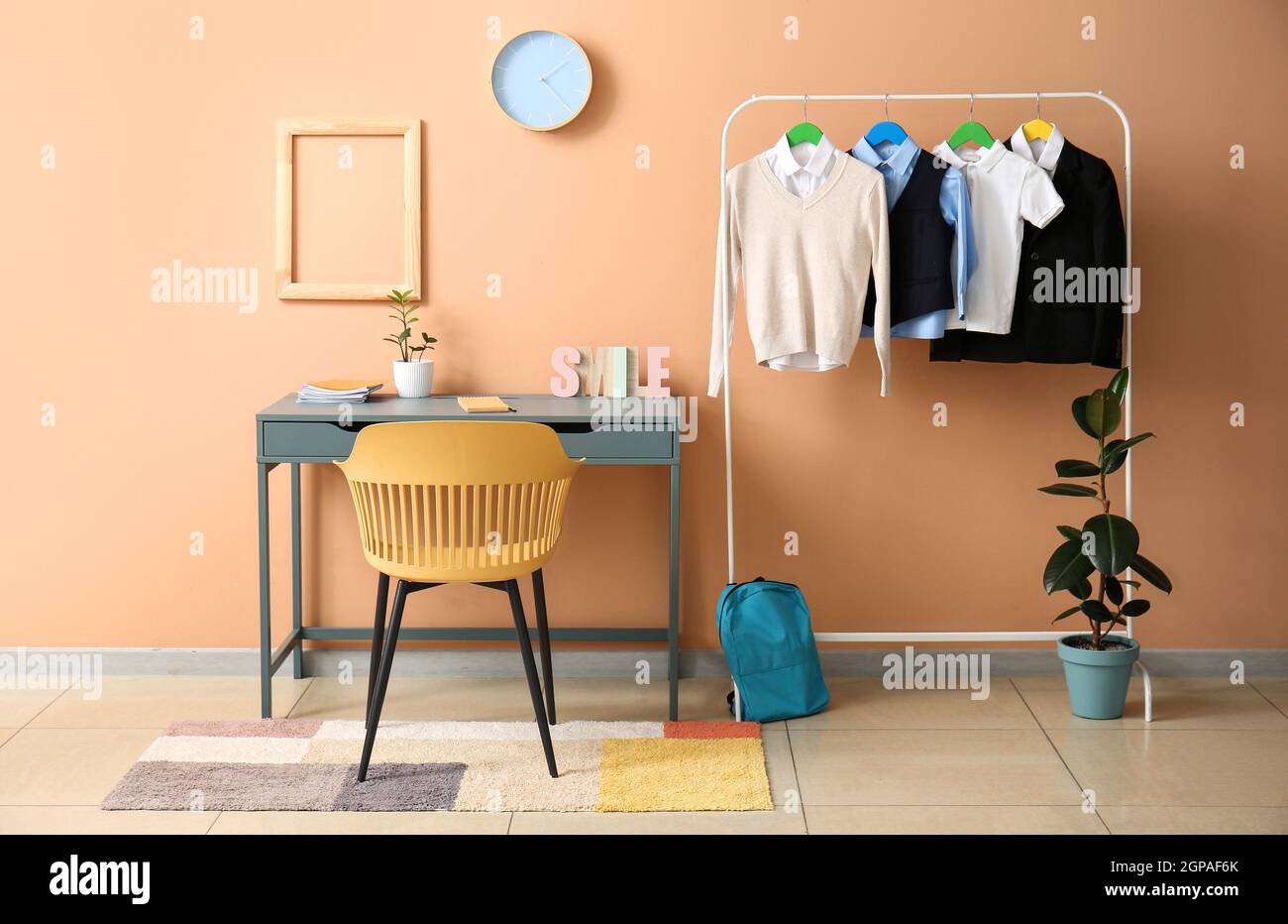 Interior of stylish room with modern workplace and school uniform Stock ...