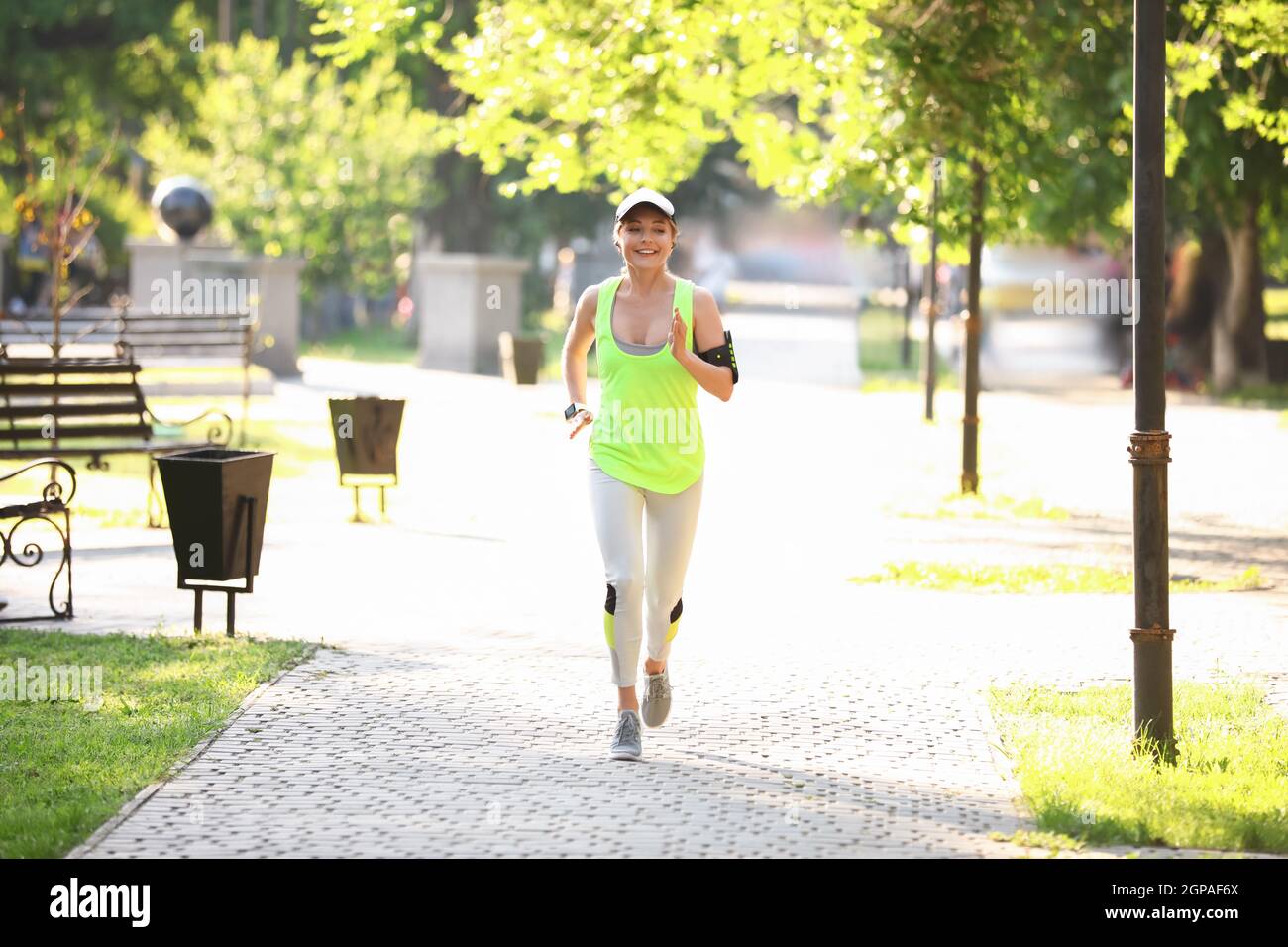 Sporty mature woman running outdoors Stock Photo - Alamy