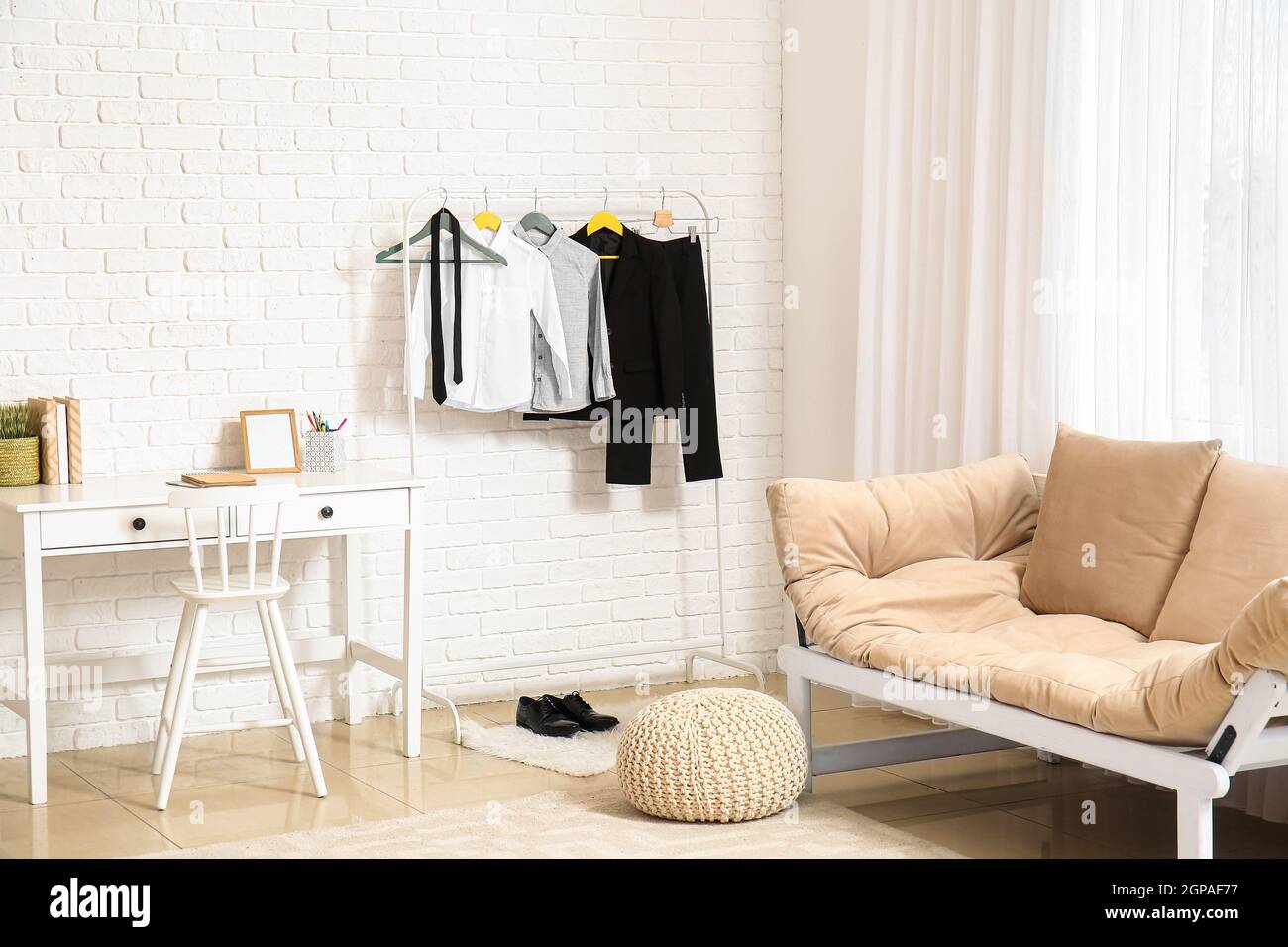 Interior of stylish room with modern workplace and school uniform Stock ...