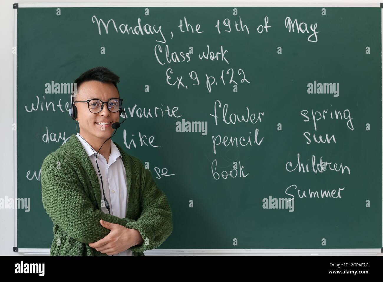 Asian teacher conducting English lesson online Stock Photo - Alamy