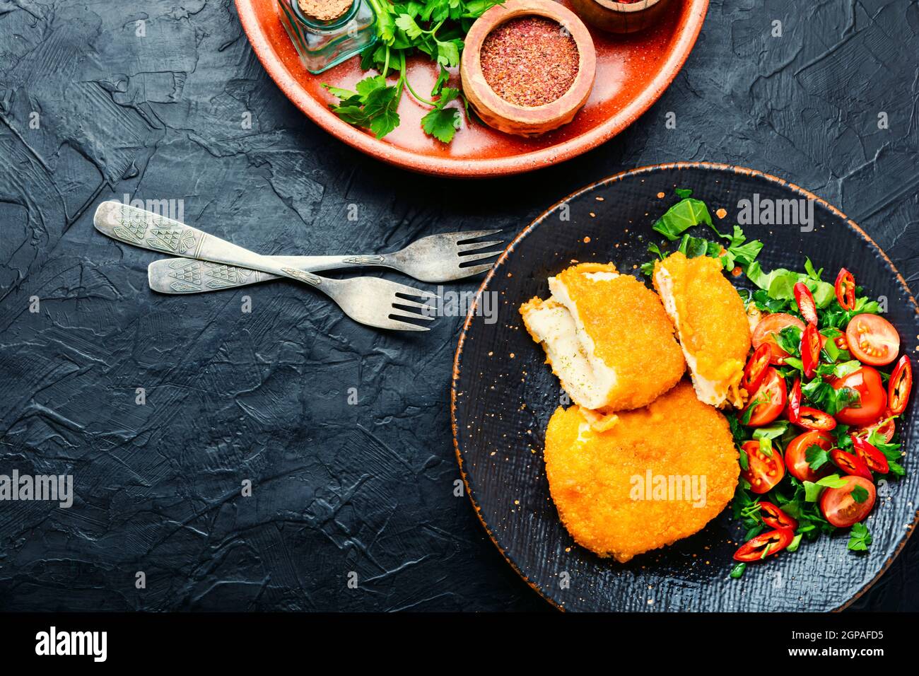 Chicken Kiev cutlet with fresh vegetable salad.Ukrainian food Stock ...