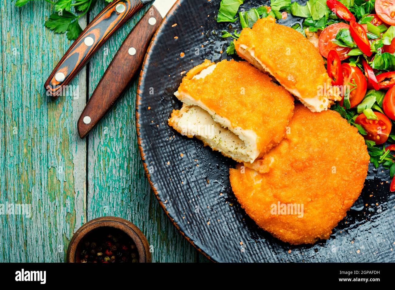 Chicken Kiev cutlet with fresh vegetable salad.Ukrainian food Stock ...
