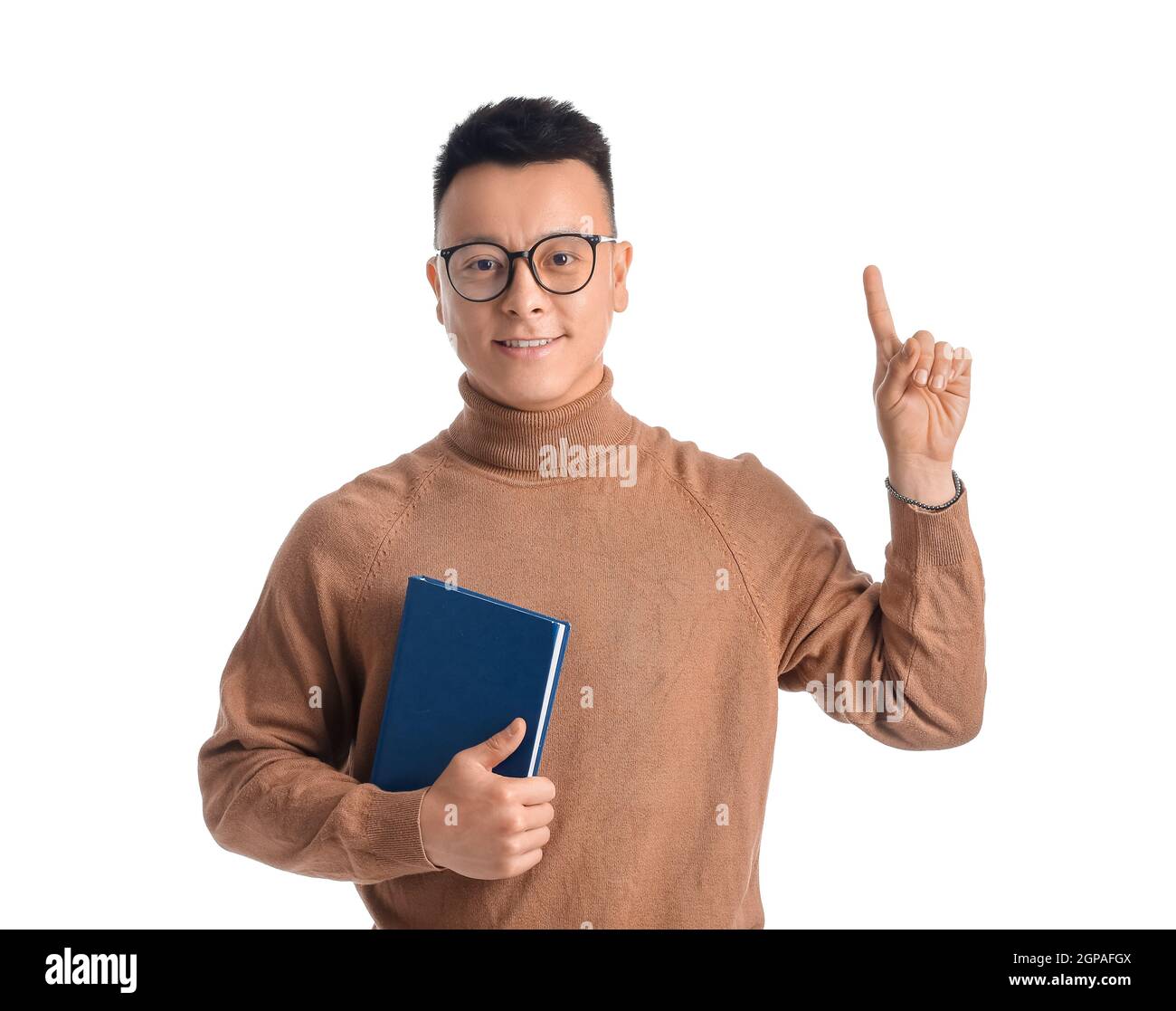 Portrait of Asian teacher with raised index finger on white background ...