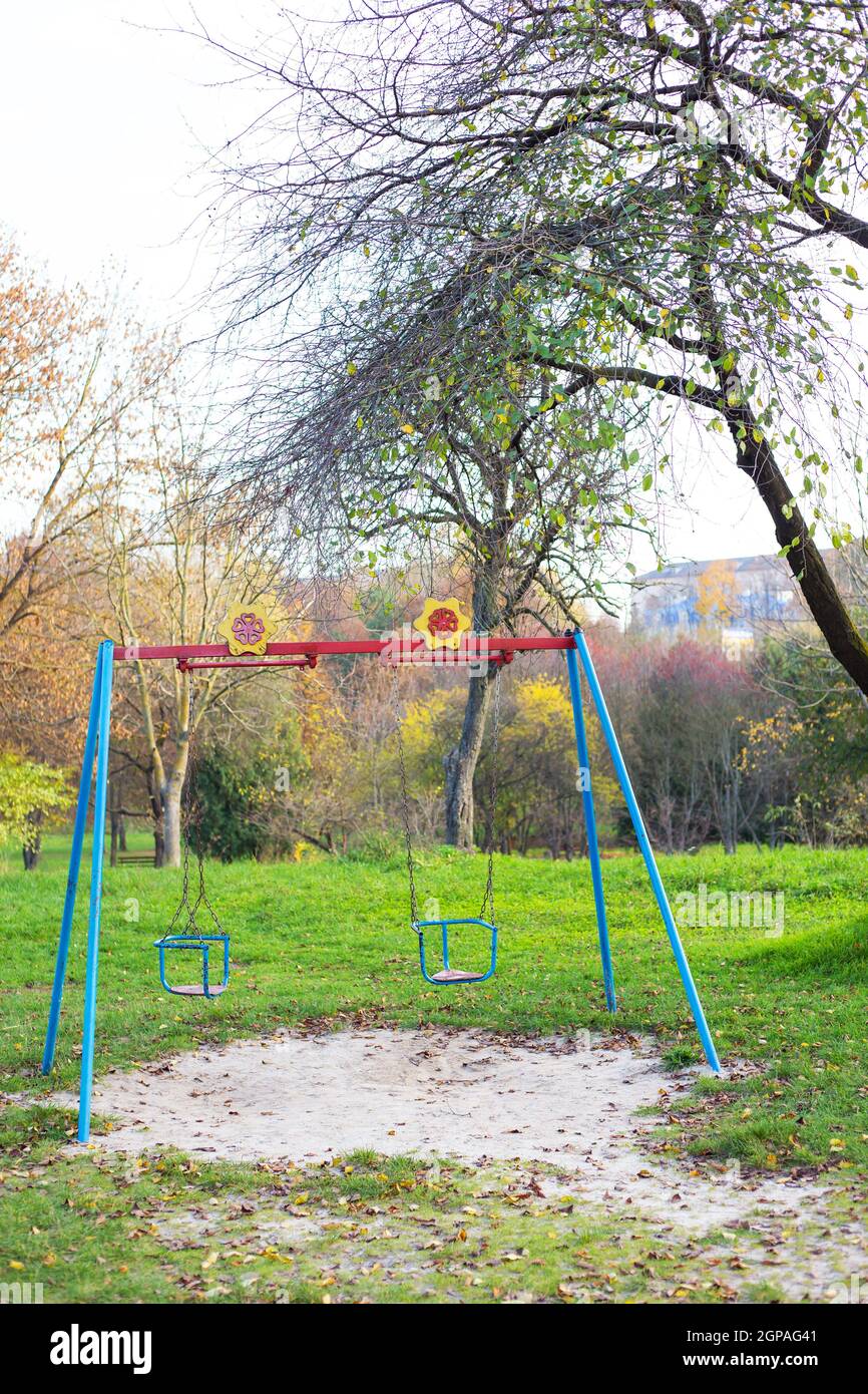 A bright playground surrounded by greenery, a beautiful and cozy park ...
